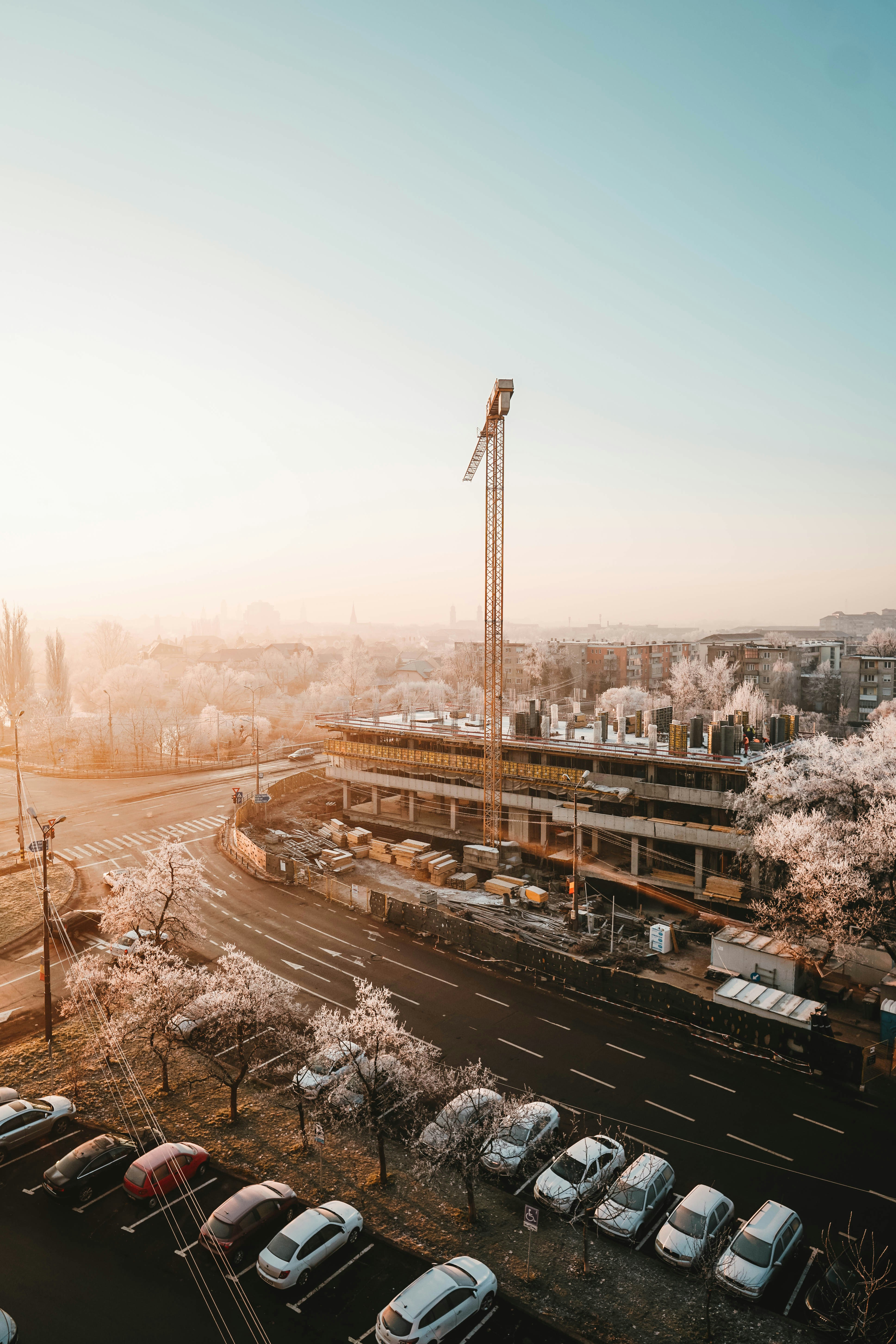 Rising Sphere: A Construction Dawn Over Quiet Streets