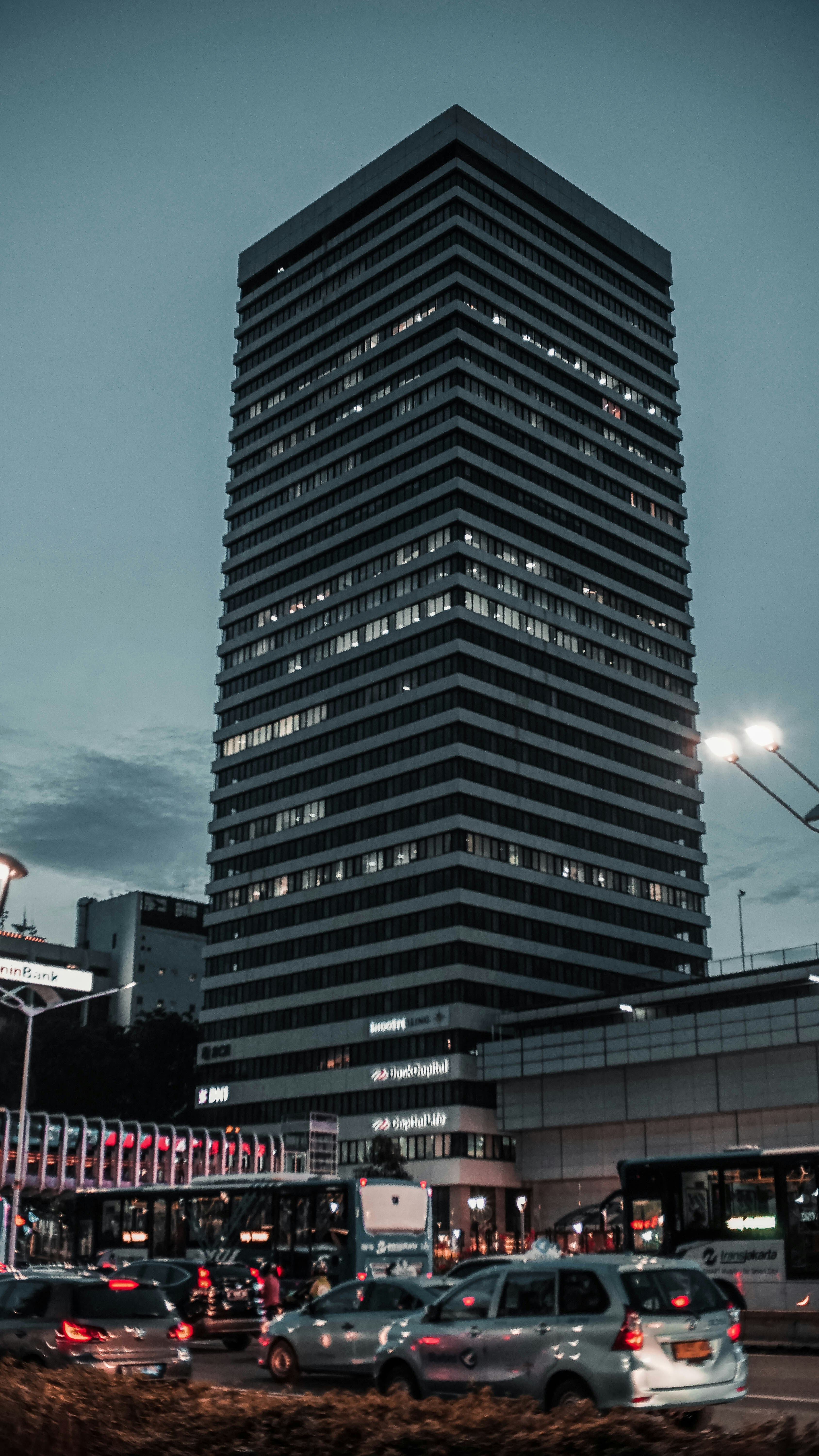 Black high rise building during night time photo – Free Indonesia Image ...