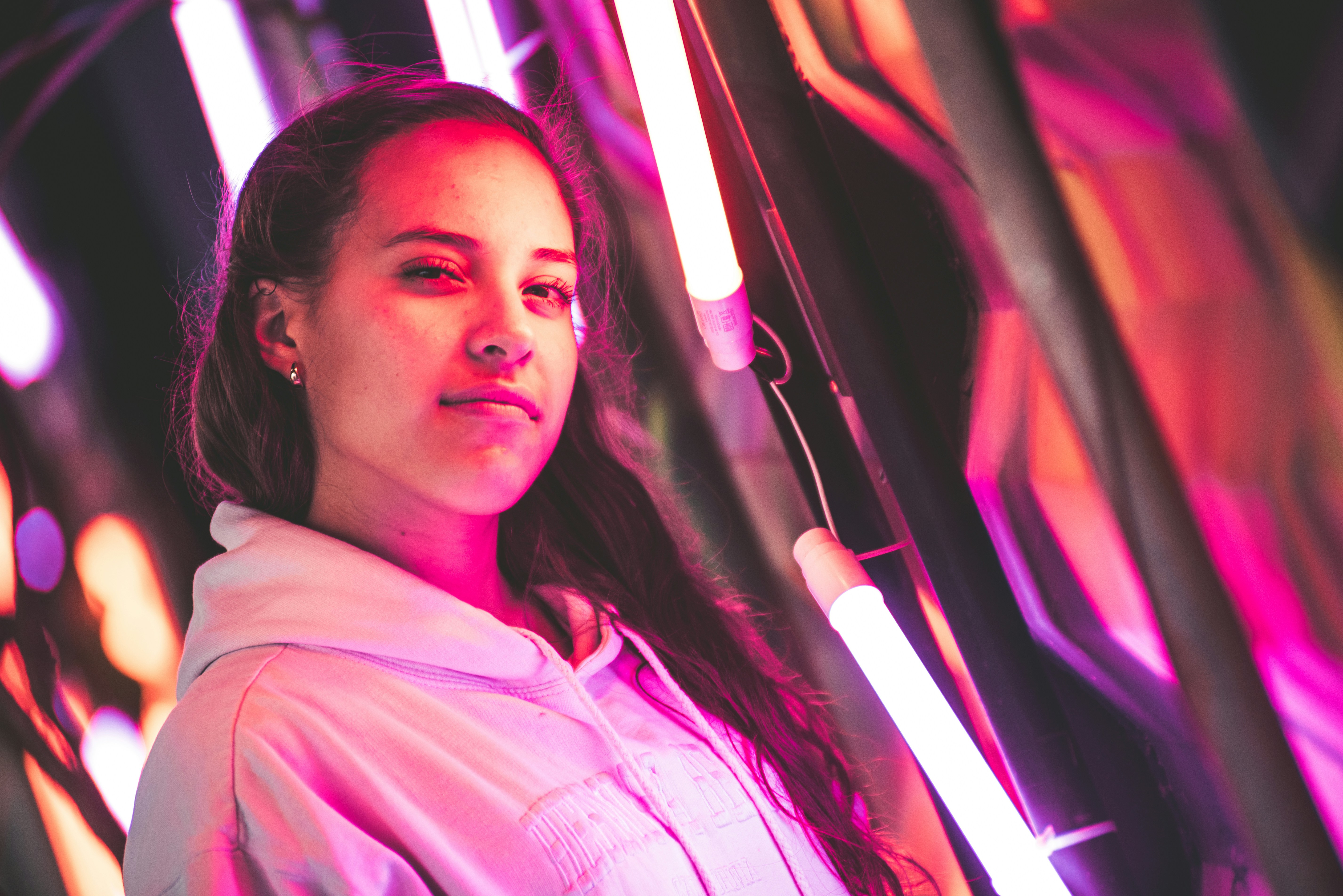Neon Quietude: Portrait Bathed in Pink and Purple Light