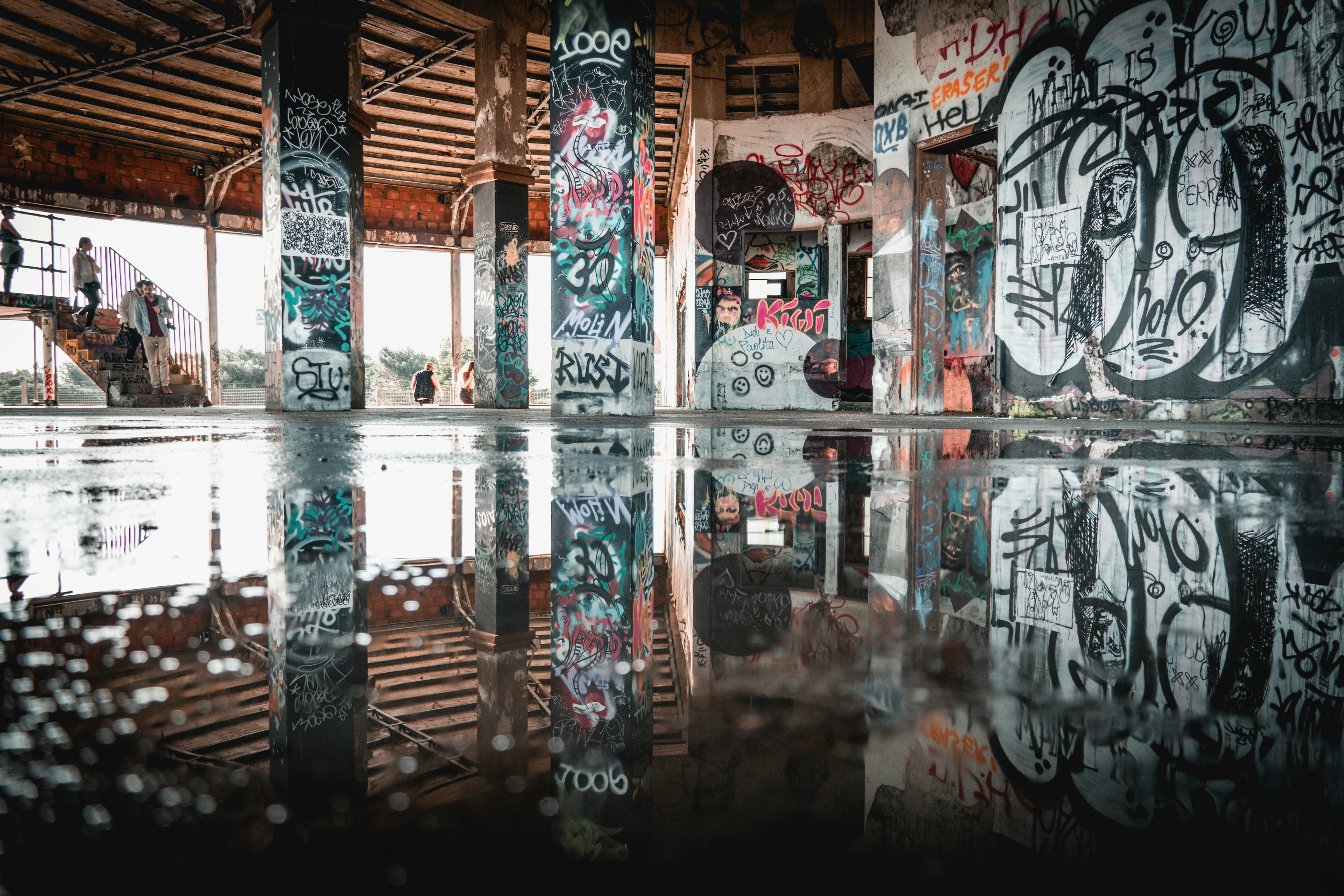 Reflections and Graffiti: An Empty Pier in Concrete Echoes