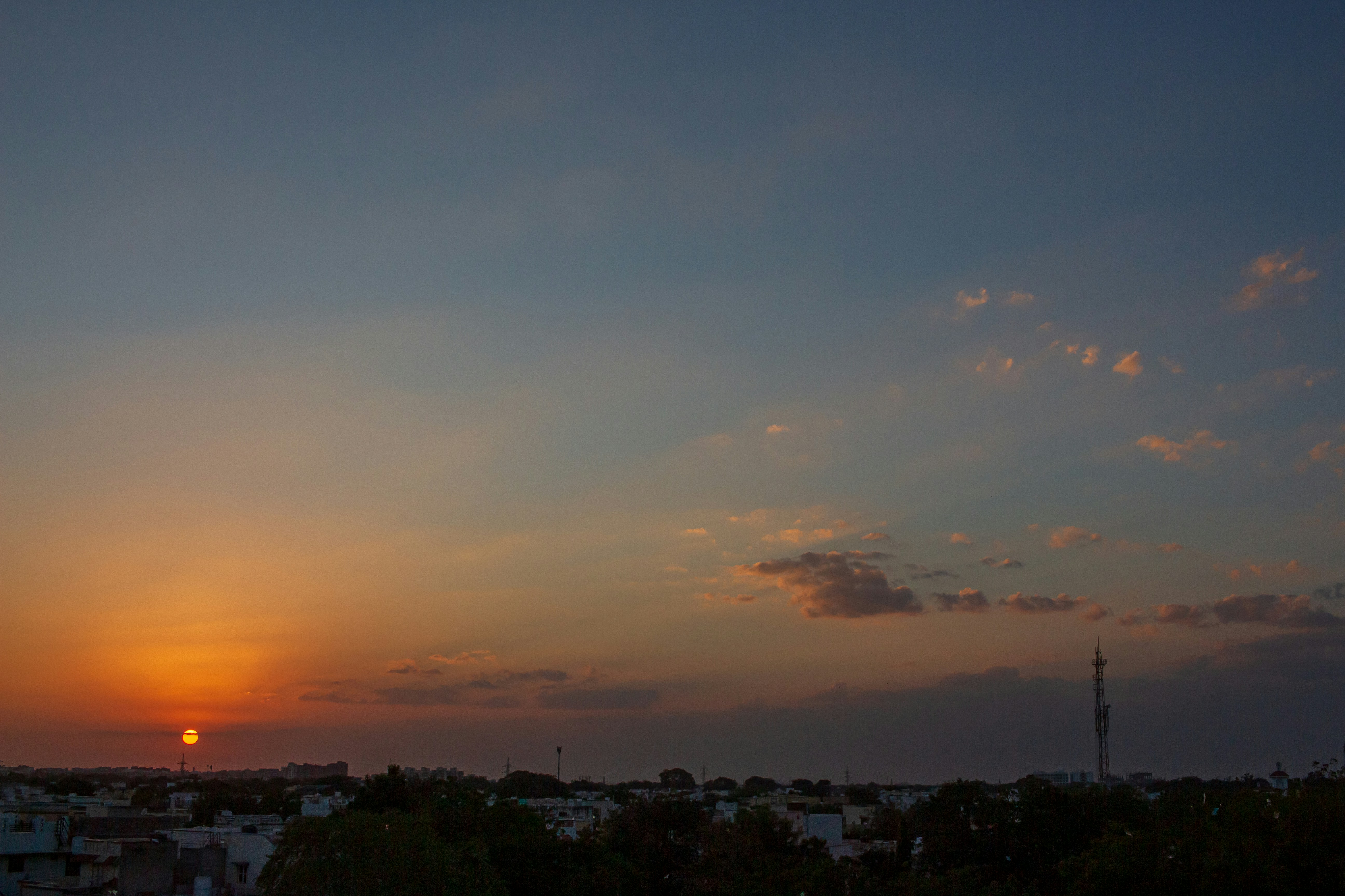 Amber Hour Over a Quiet City Horizon