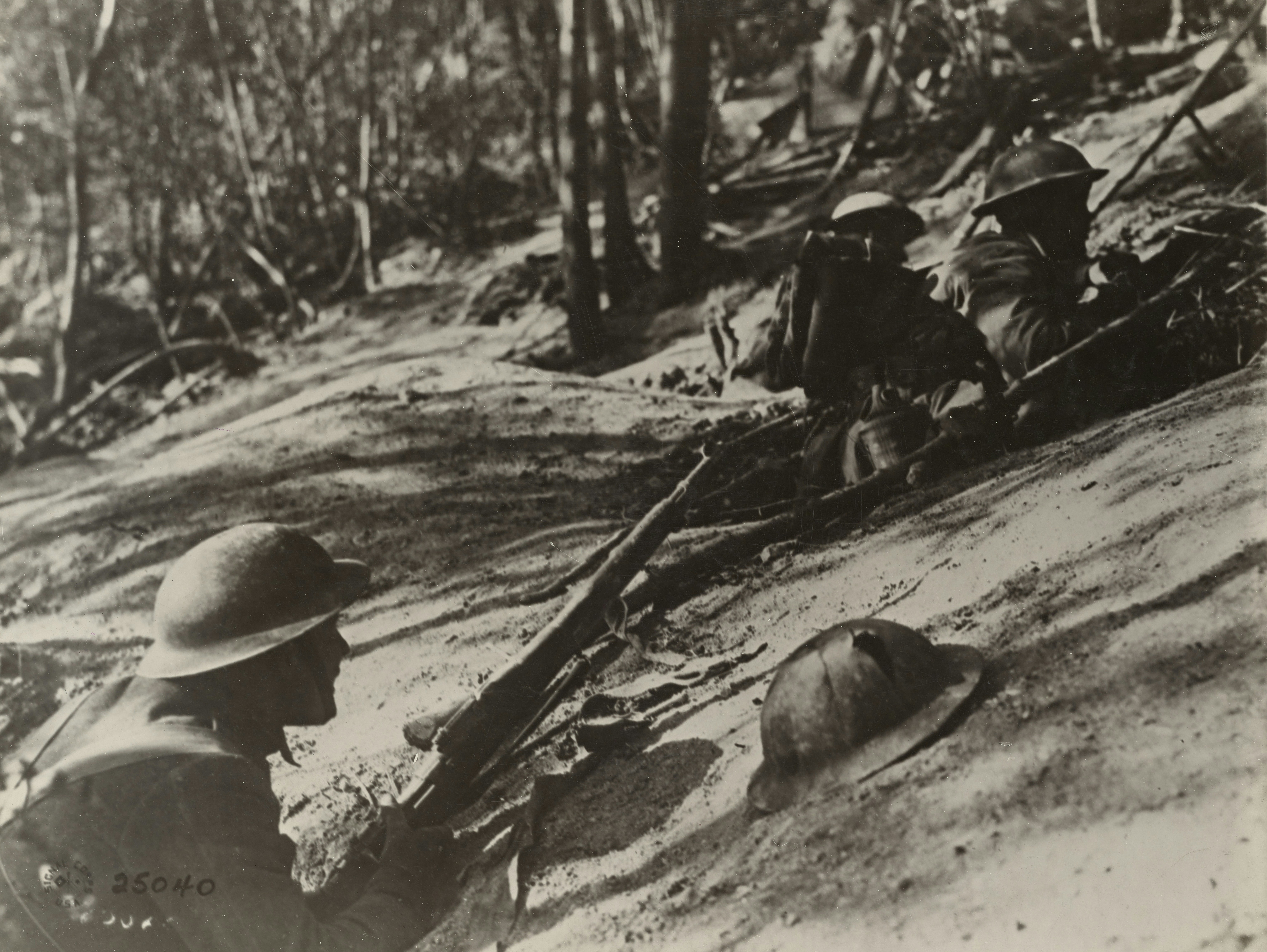 Grayscale photo of 2 american soldiers sitting on ground in the first ...