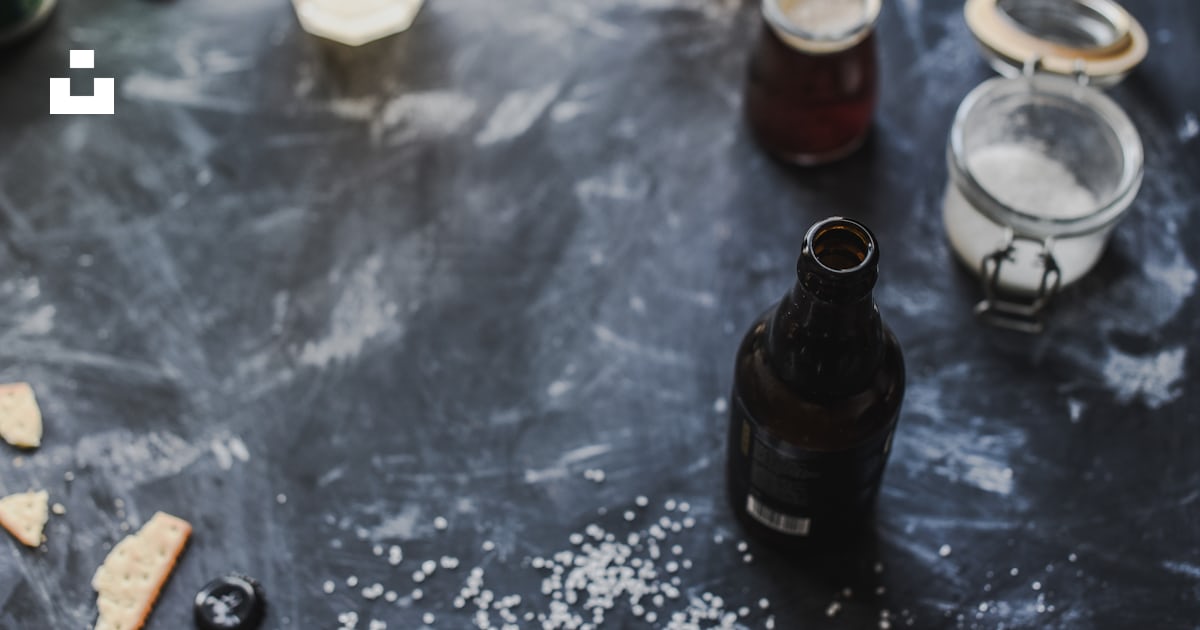 Black Glass Bottle Beside Clear Drinking Glass Photo Free Grey Image