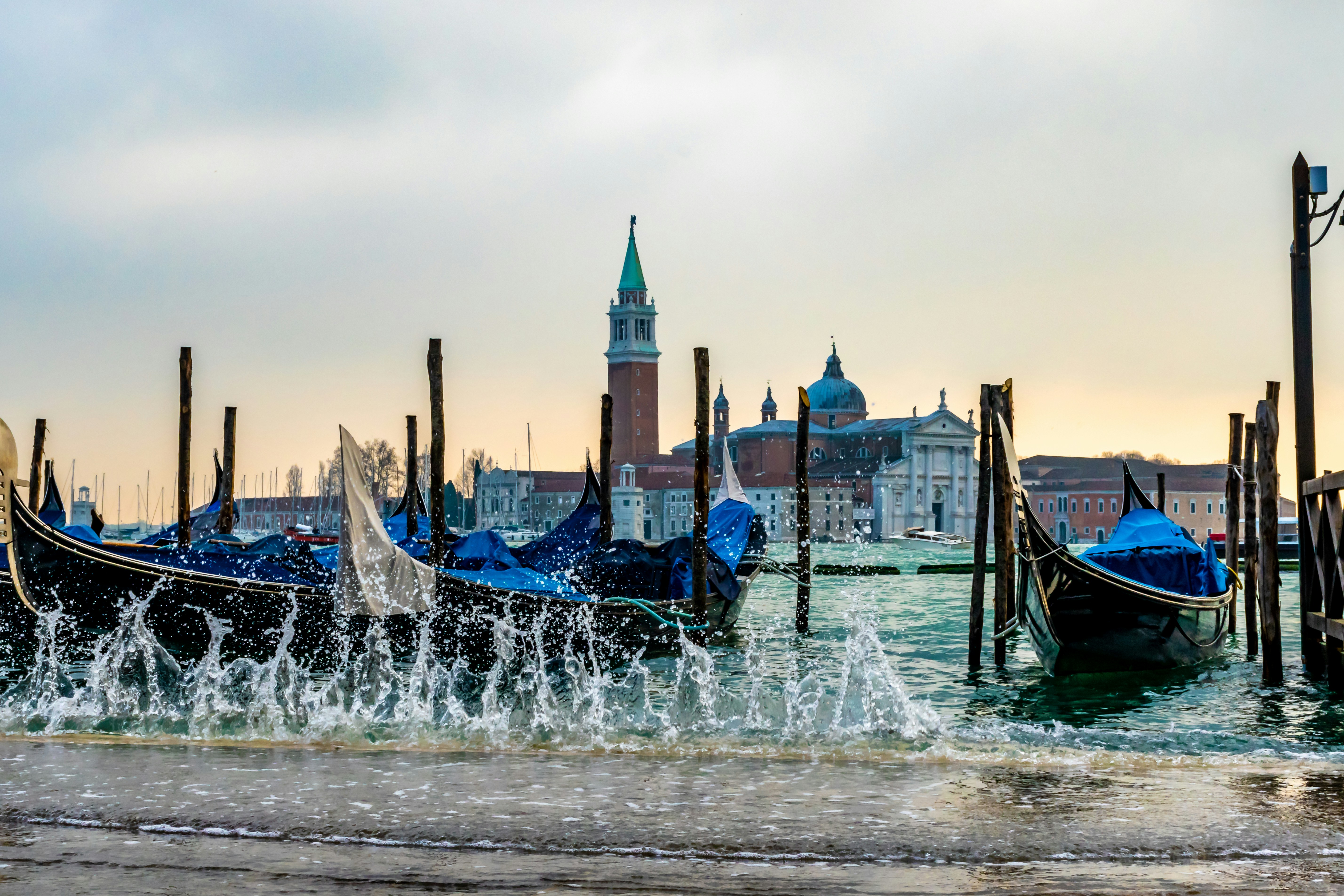 People riding on boat on water near buildings during daytime photo ...