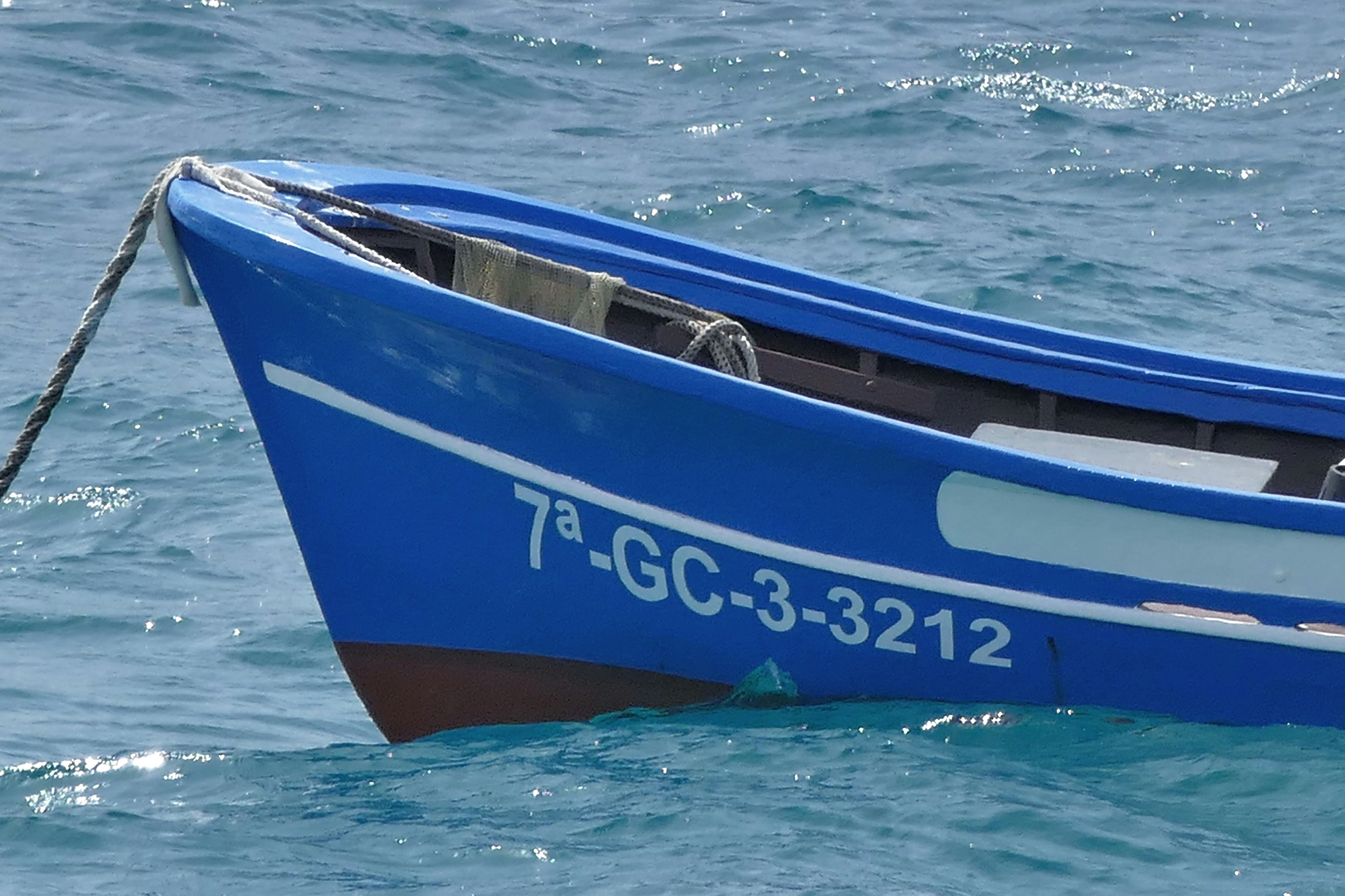 Blue and brown boat on blue sea during daytime photo – Free Sea Image ...