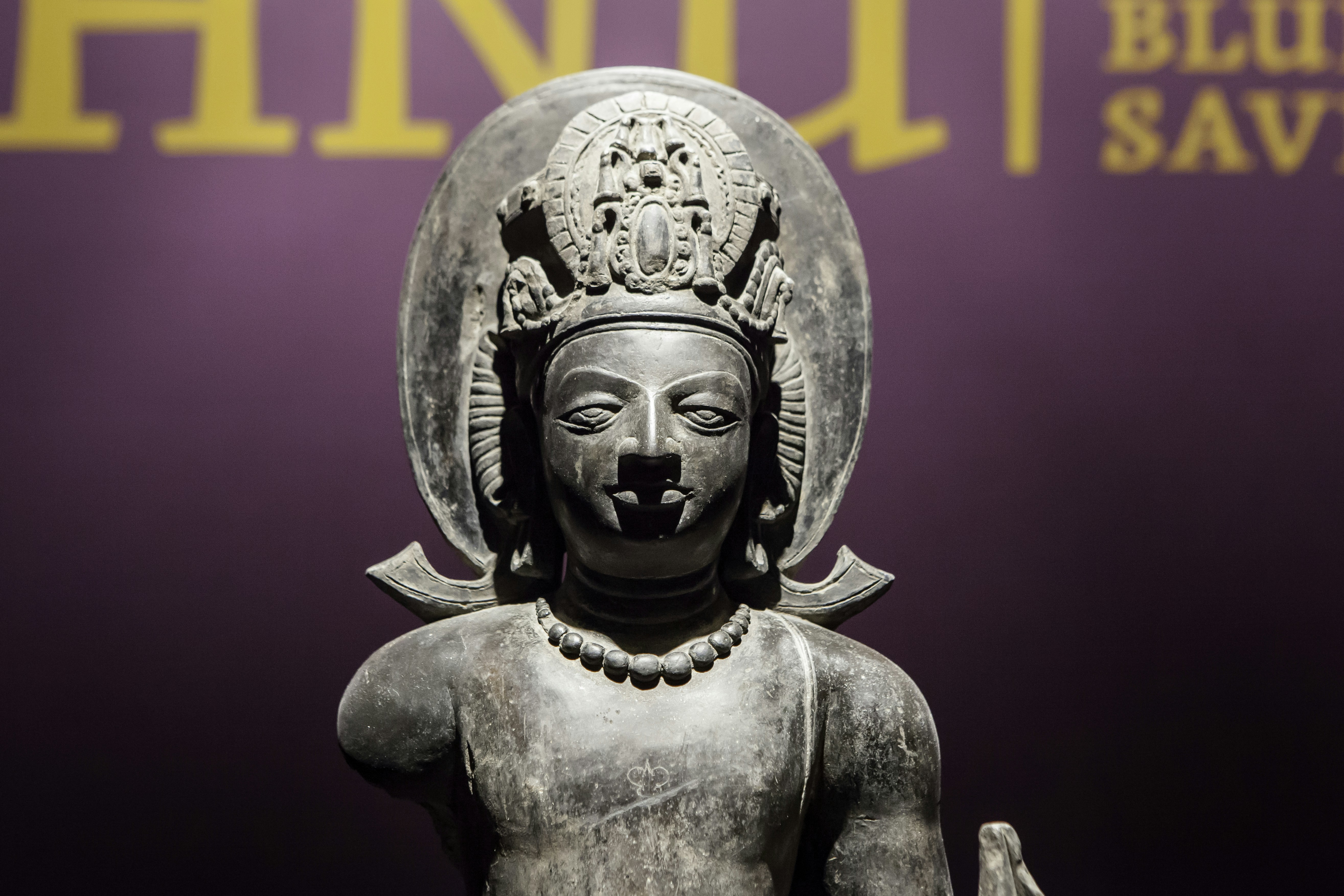Bodhisattva in Velvet Purple: A Stone Portrait