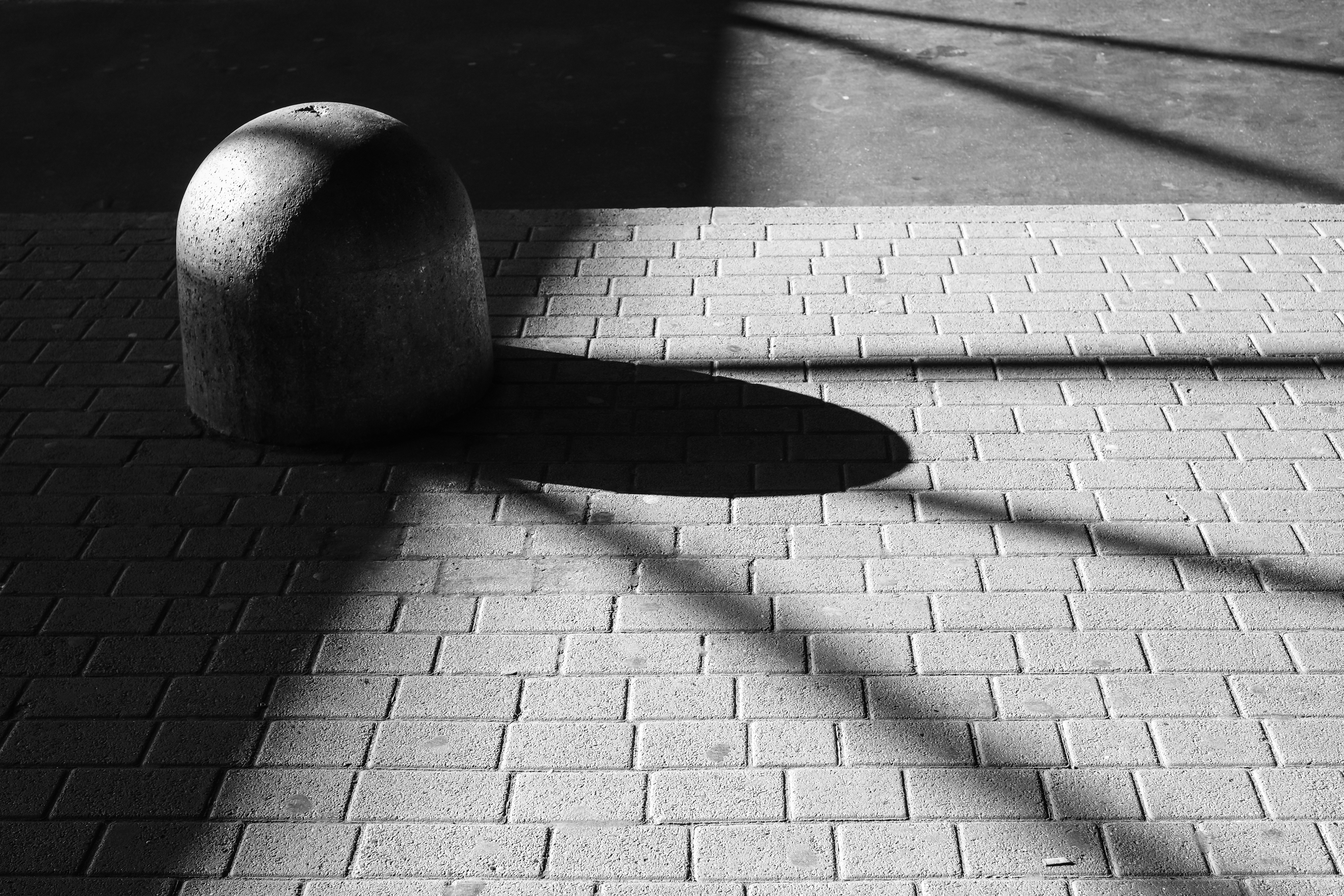 Grayscale photo of round ball on brick pavement photo – Free Grey Image ...