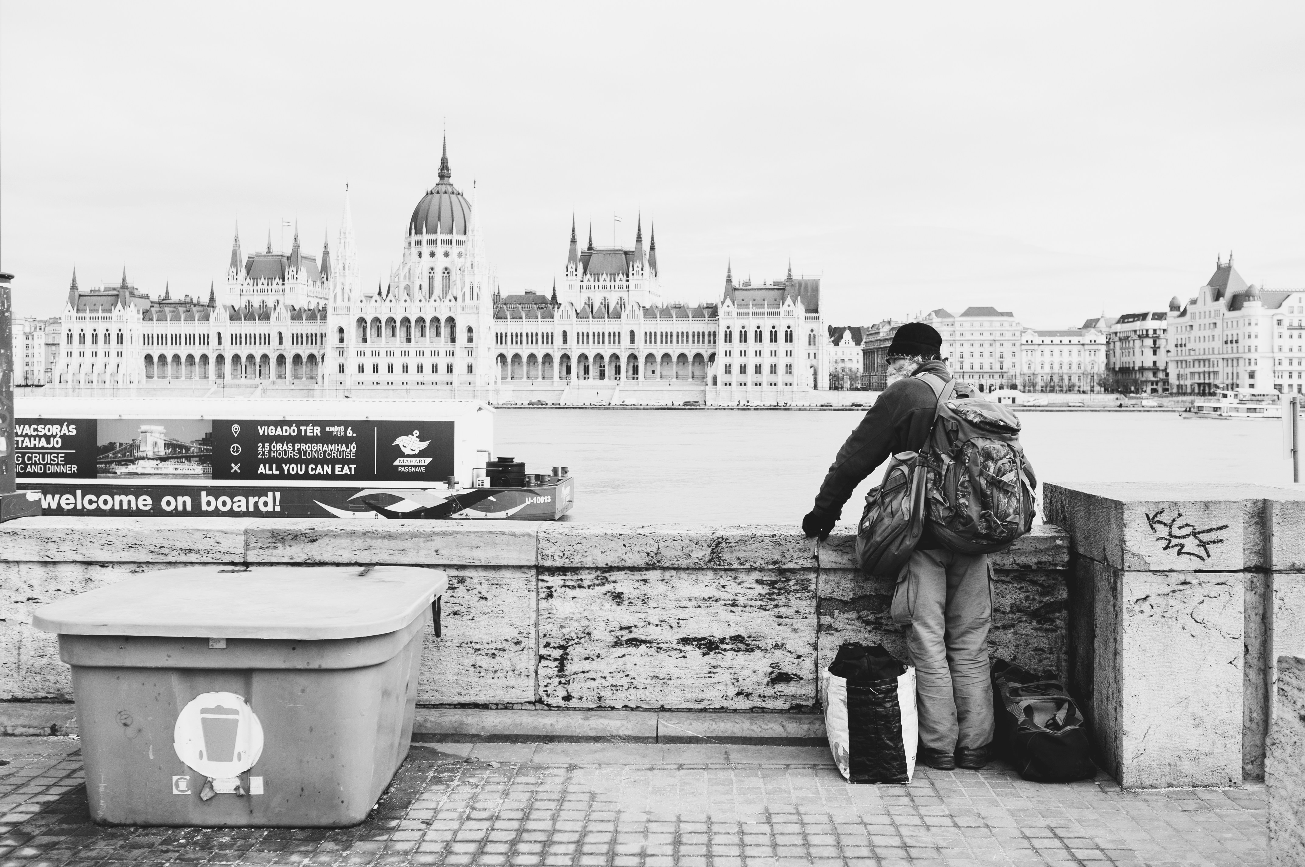 Danube Vigil: A lone traveler by Budapest's Parliament