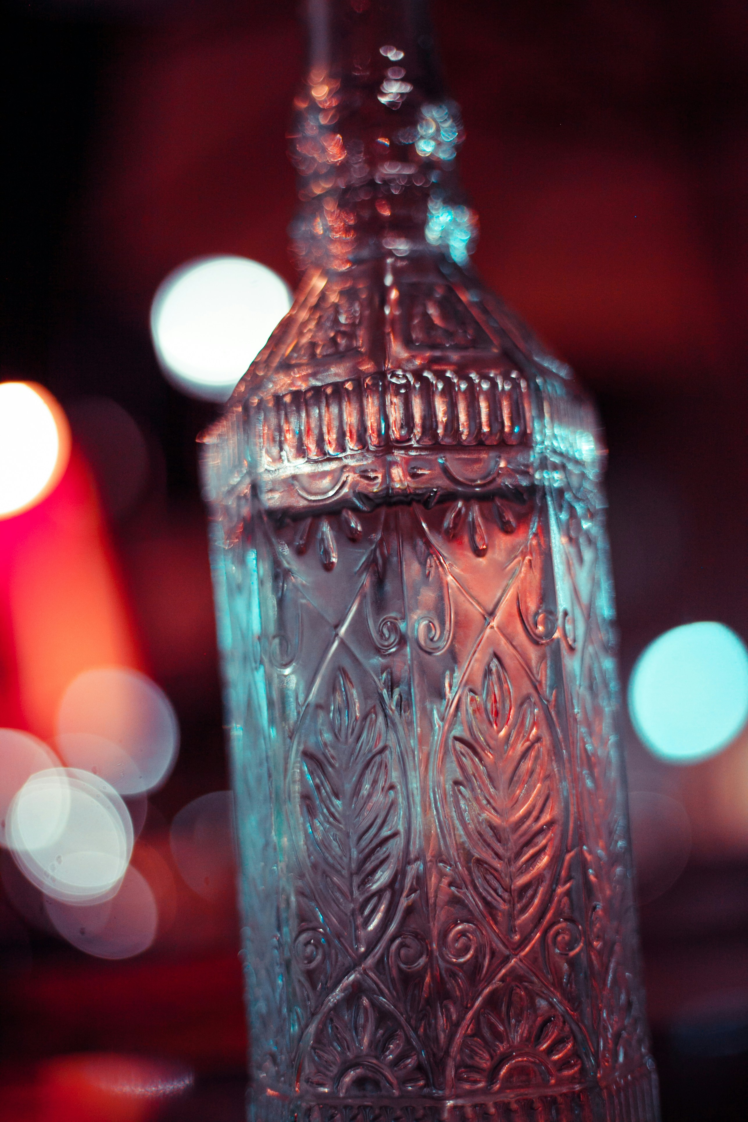 green glass bottle with red light