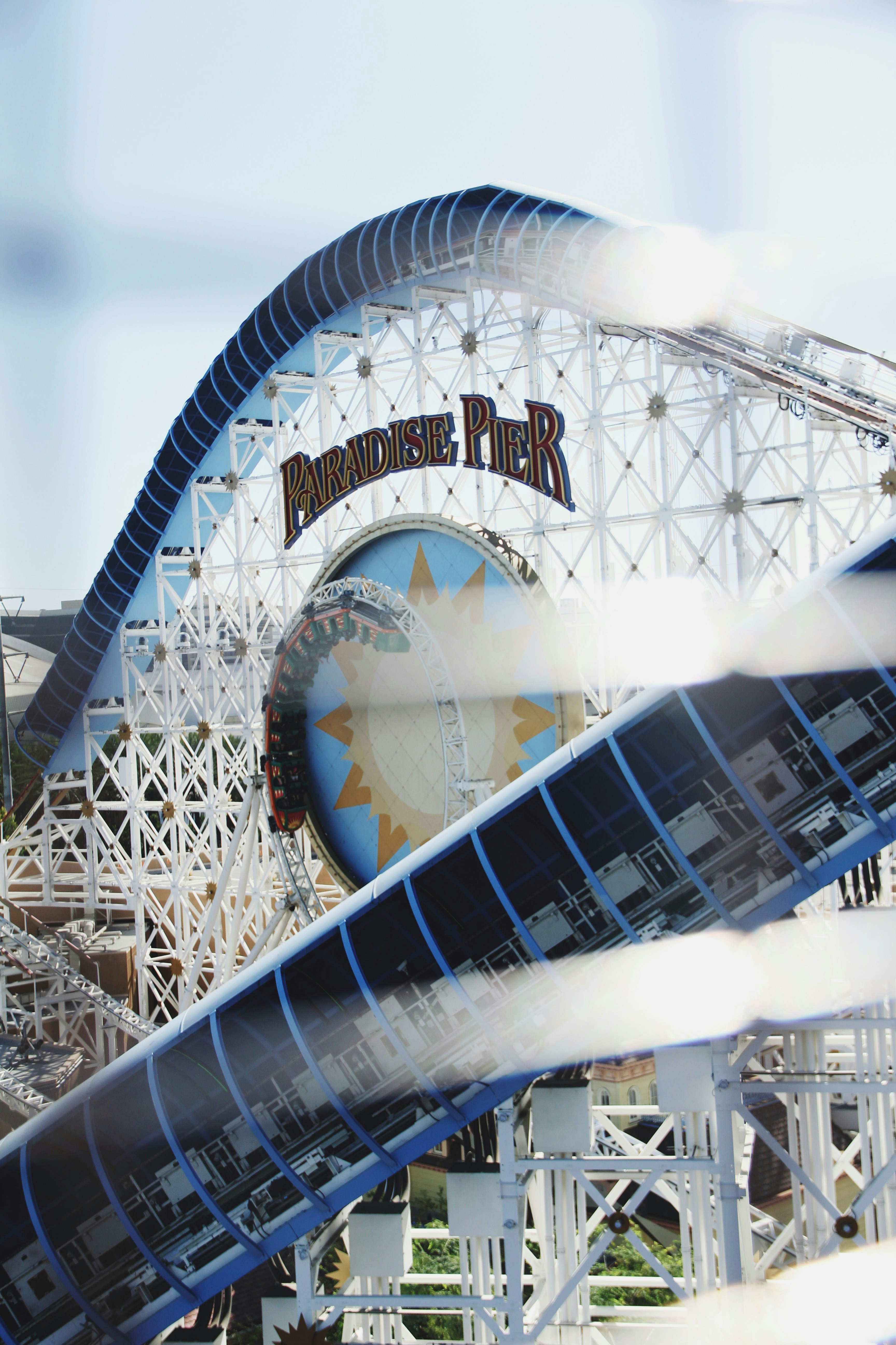 Paradise Pier Sign Framed by Blue Arches and Steel Lattice