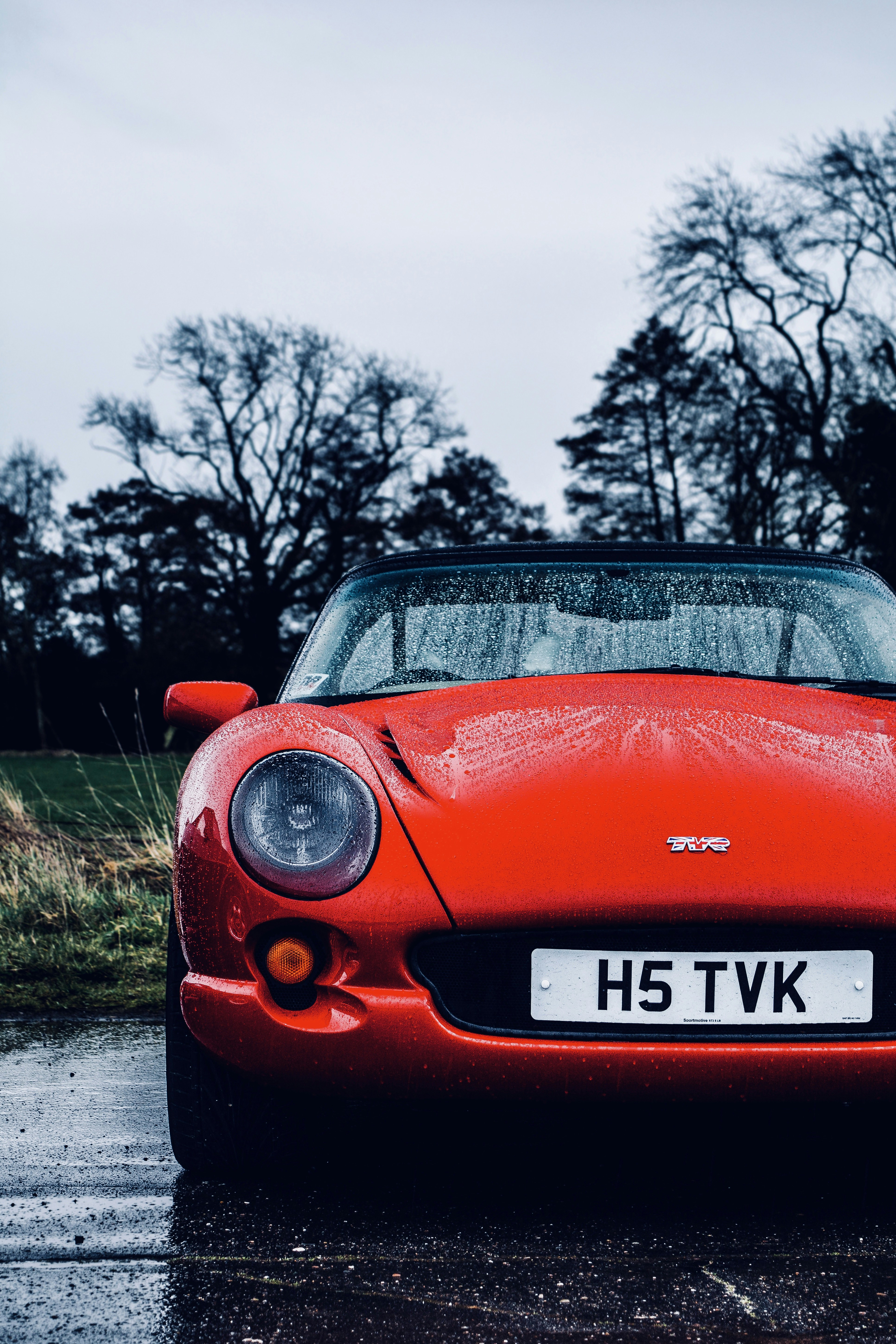 Crimson Porsche 964 Front in Rain: A Wet-Weather Portrait