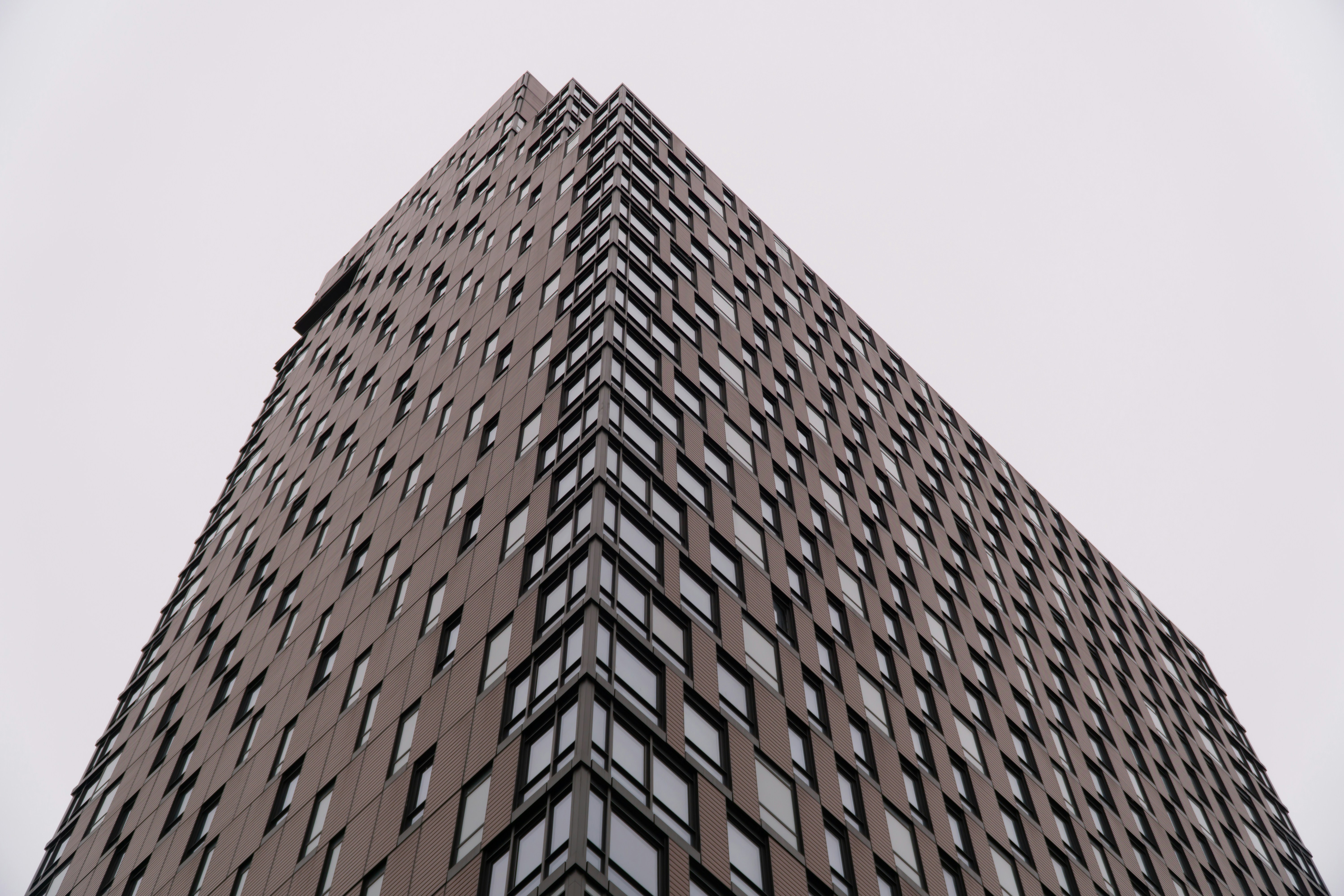 brown concrete building under white sky during daytime