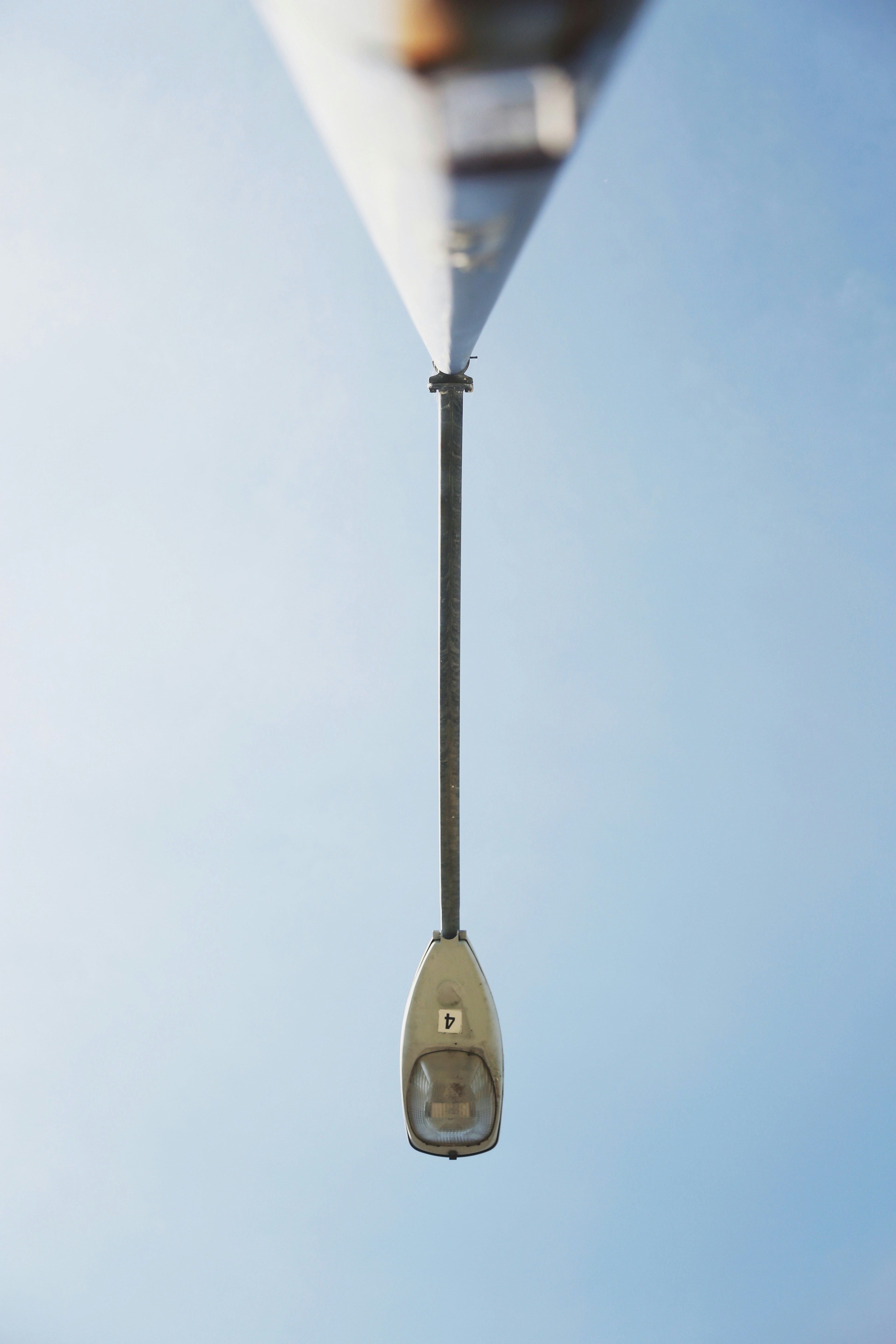 white street light under blue sky during daytime