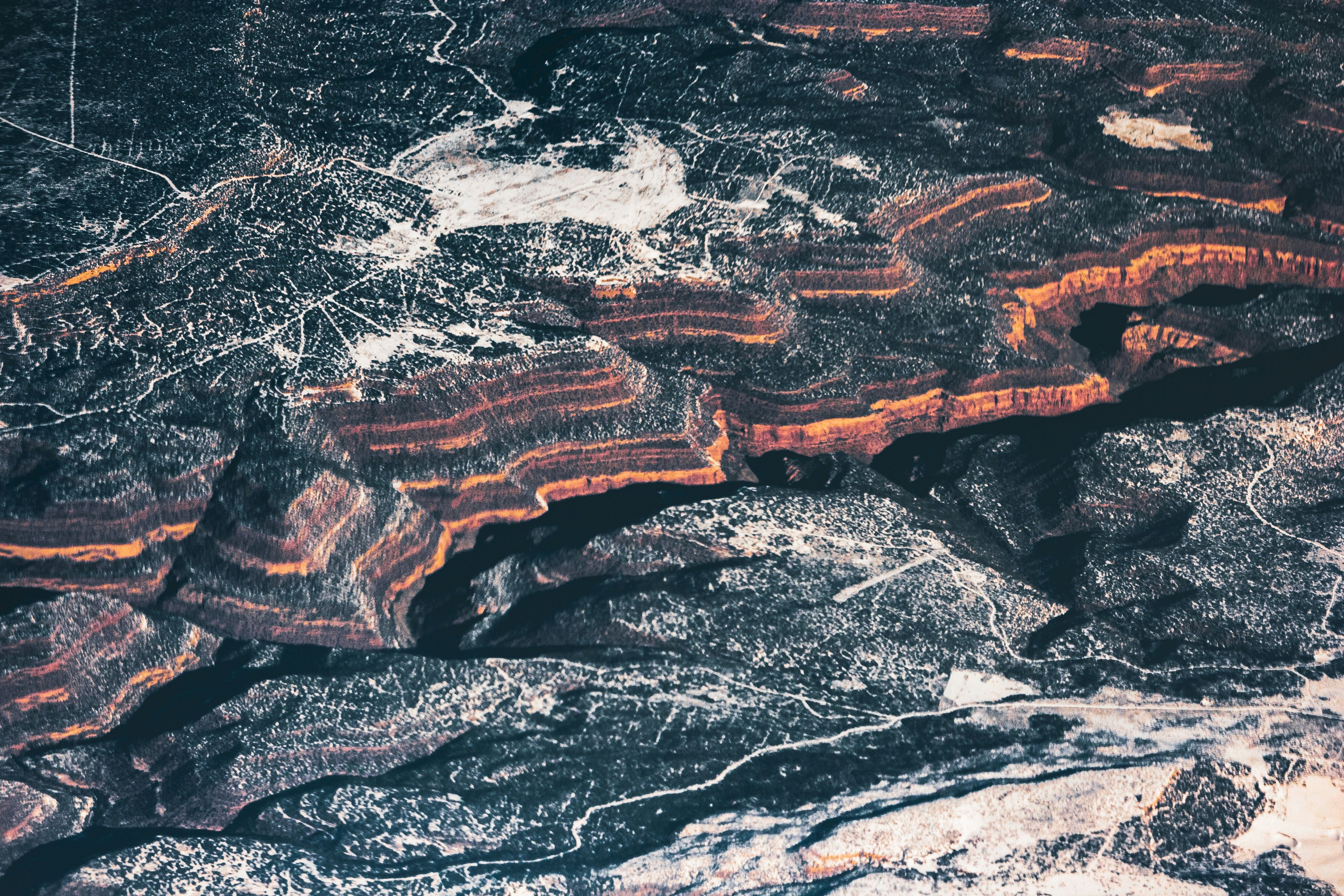 Ember Strata: Winding Red Layers Carved in Weathered Rock
