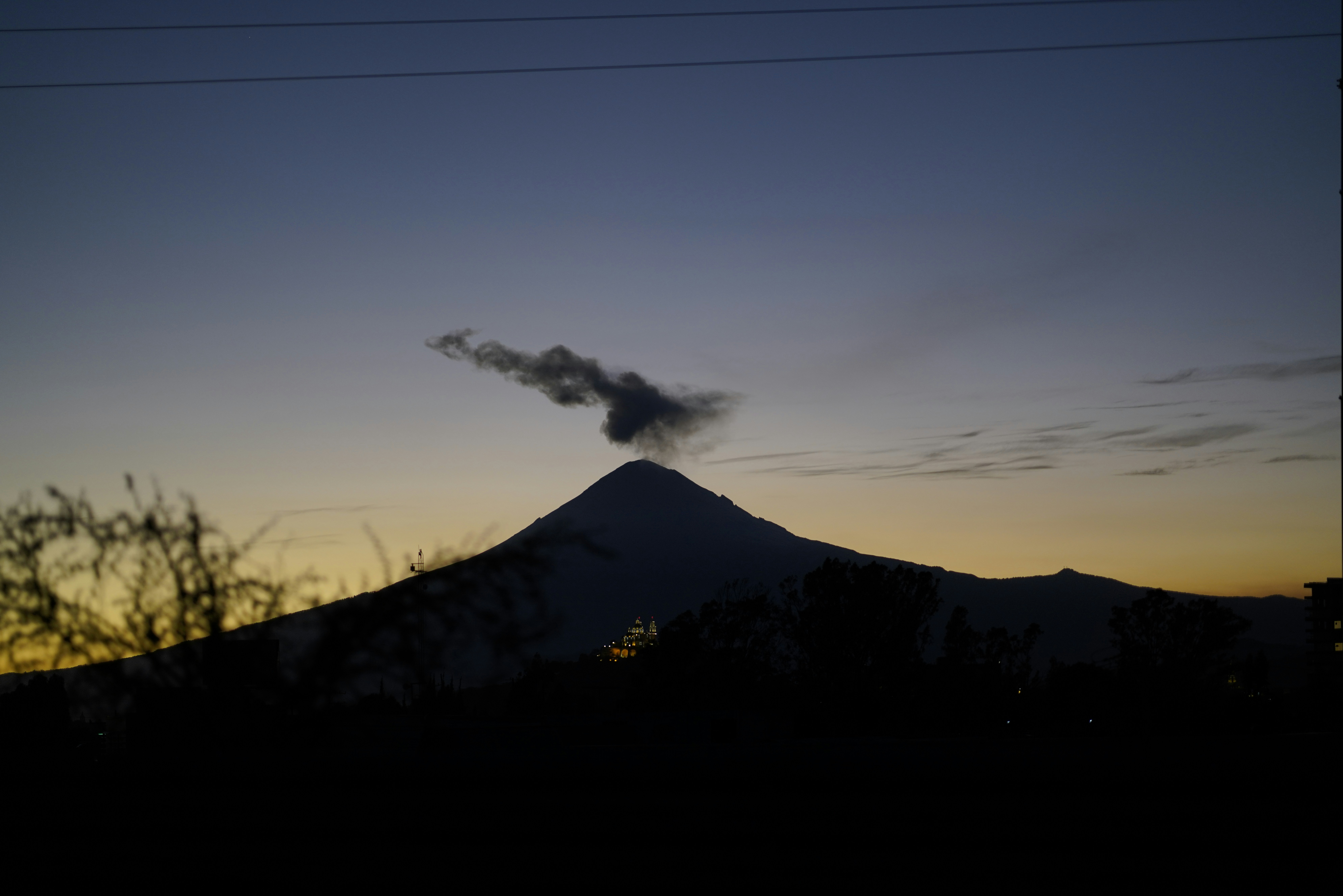Dusk Summit: Smoke Tracing the Quiet Volcano