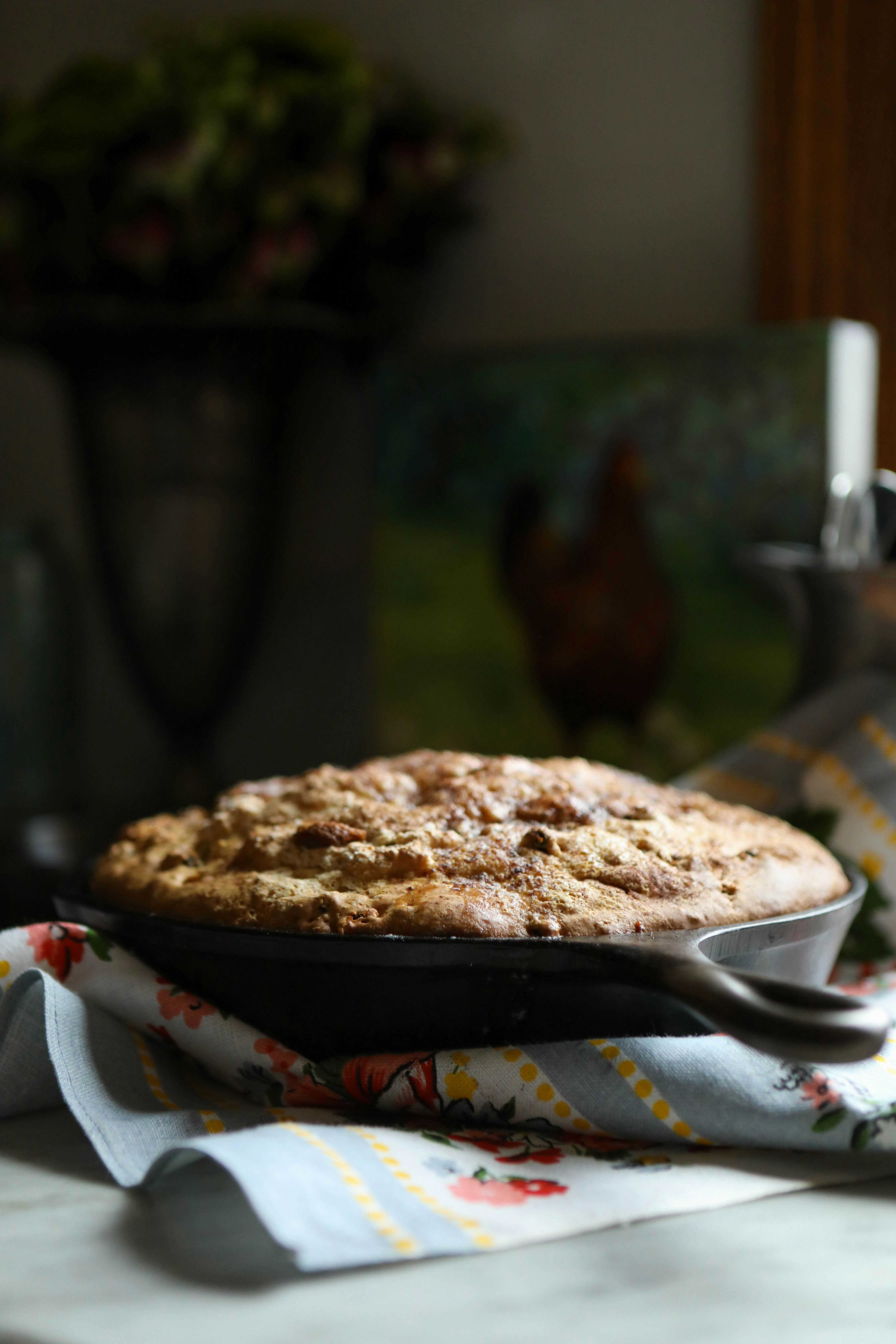 Nut-Topped Rustic Pie in a Cast-Iron Pan on Floral Cloth