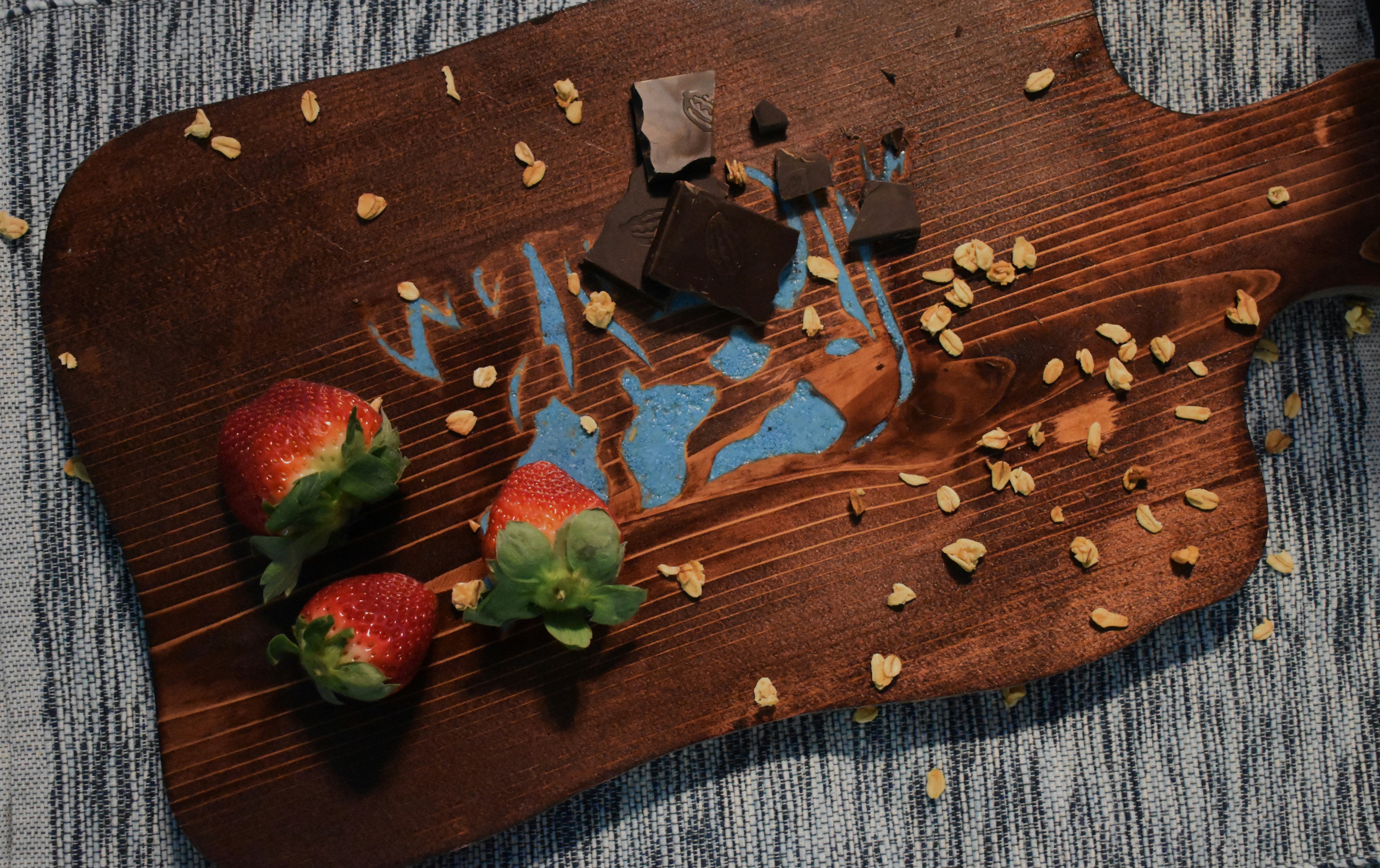 Rustic Sweetness: Strawberries Meet Cocoa on Weathered Wood