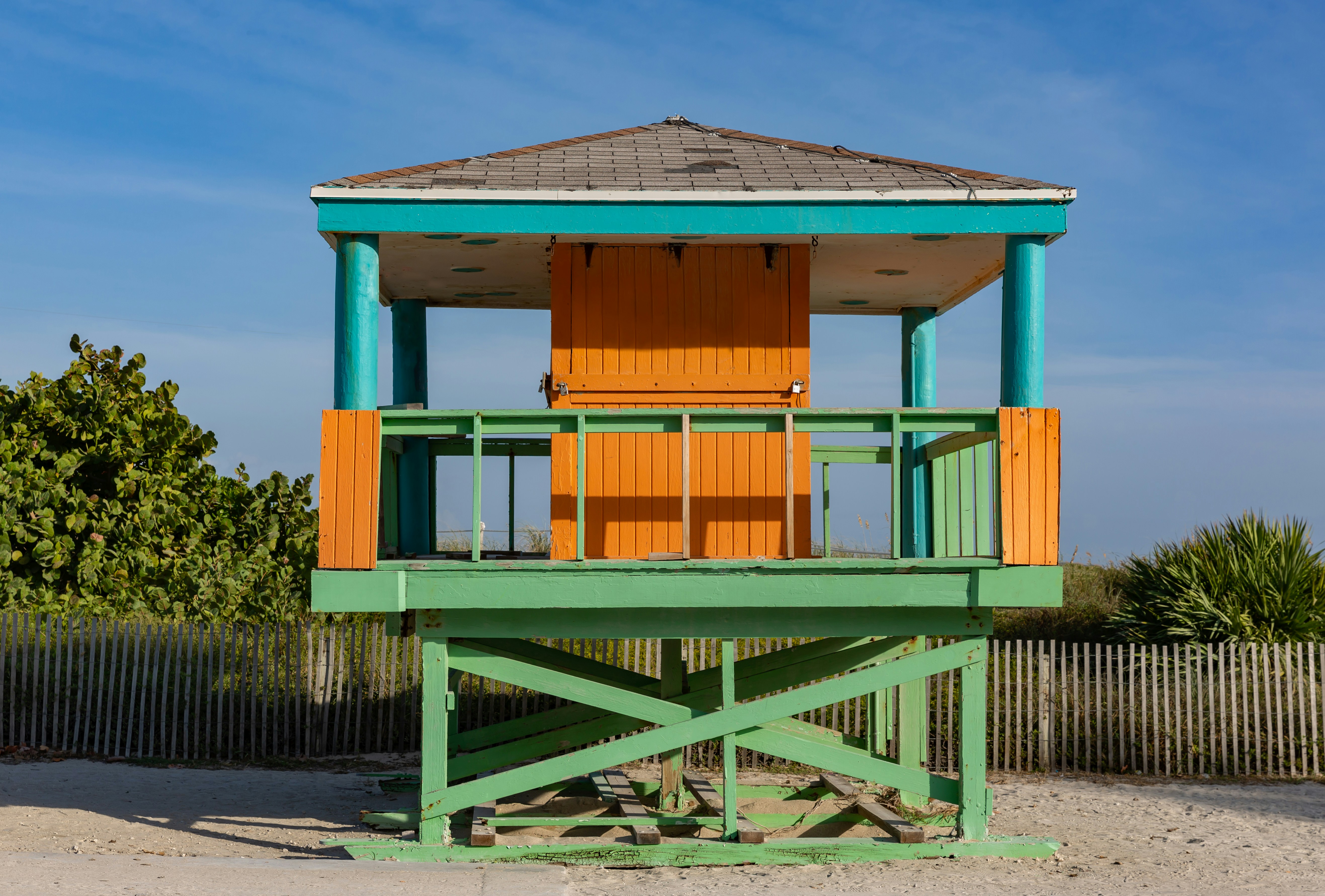 Colorblocked Lifeguard Tower Rises Over a Quiet Beach