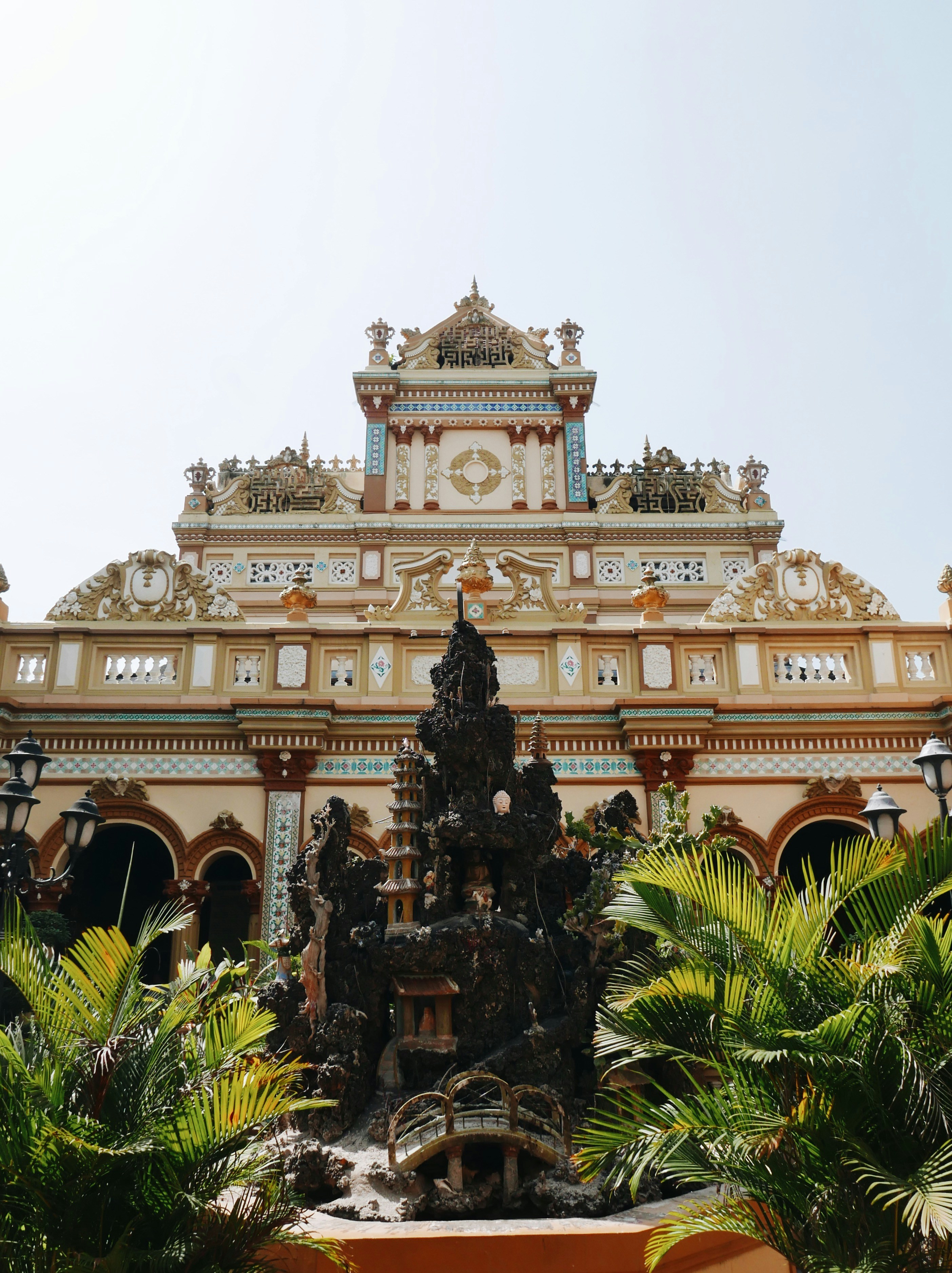 Centerpiece of Stone and Gilded Facade: The Dark Fountain Framing a Palatial Front