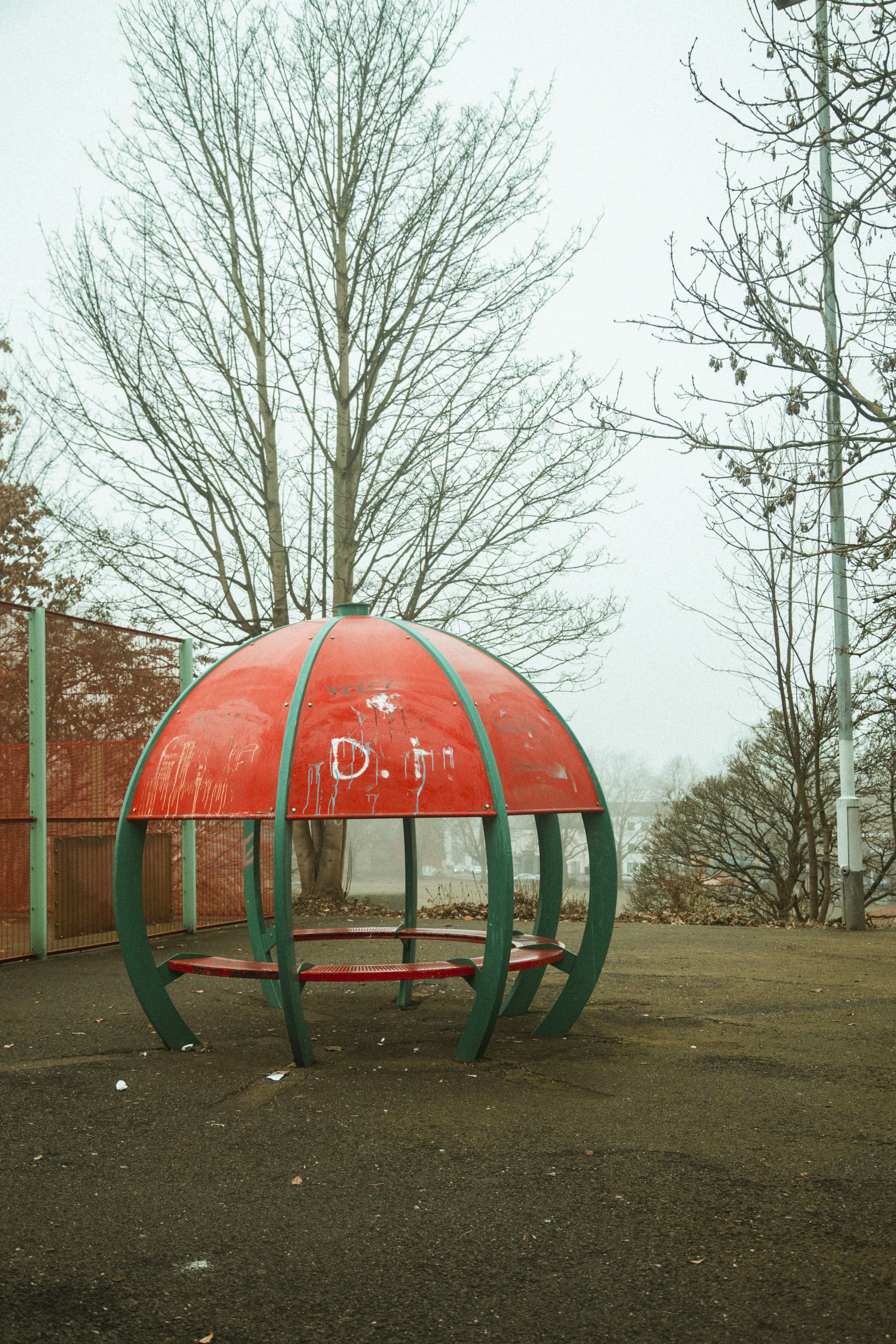 Red Dome Gazebo with Green Arches in a Quiet Winter Park