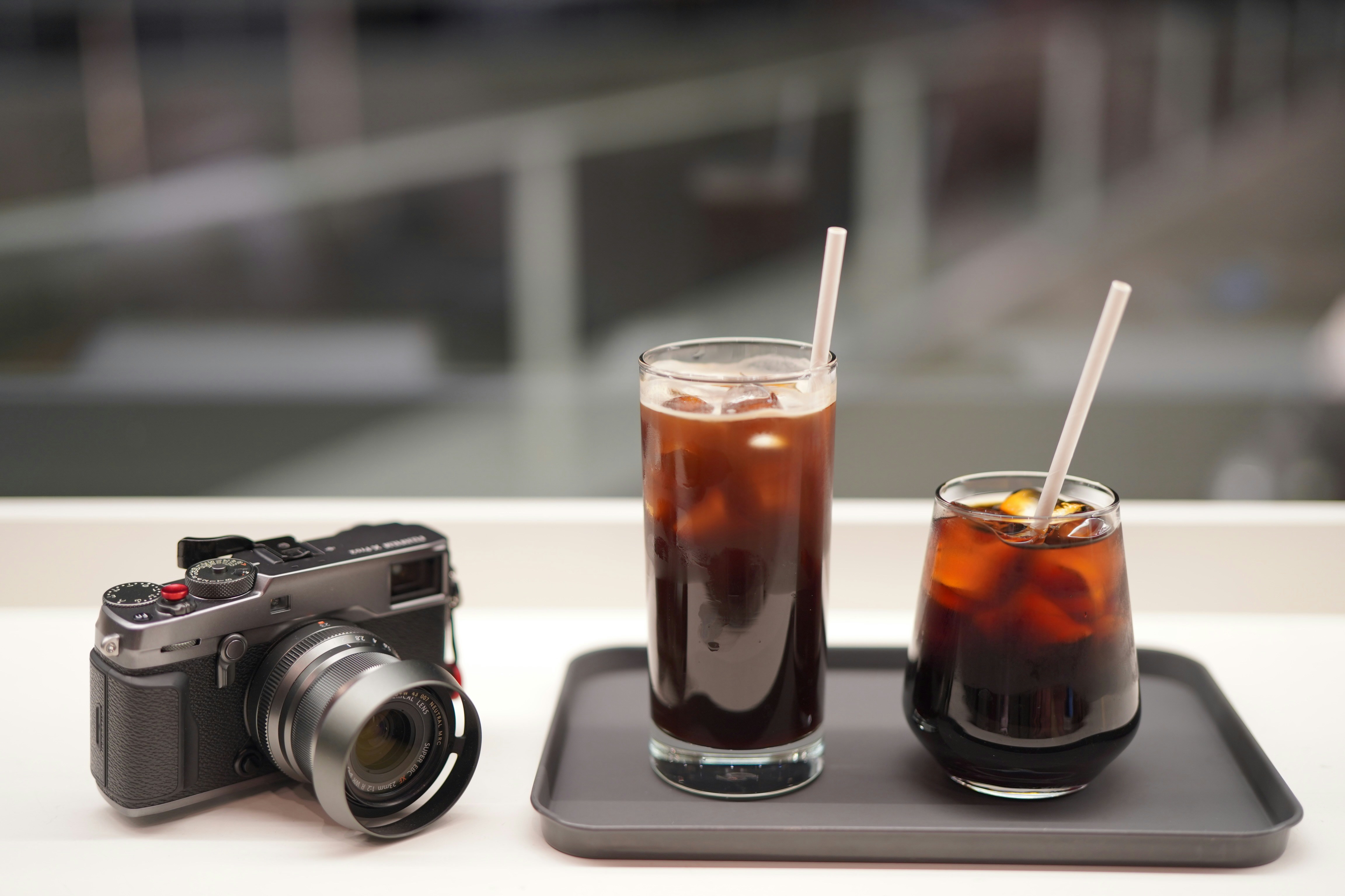 Two Iced Coffees and a Vintage Camera: A Quiet Countertop Moment