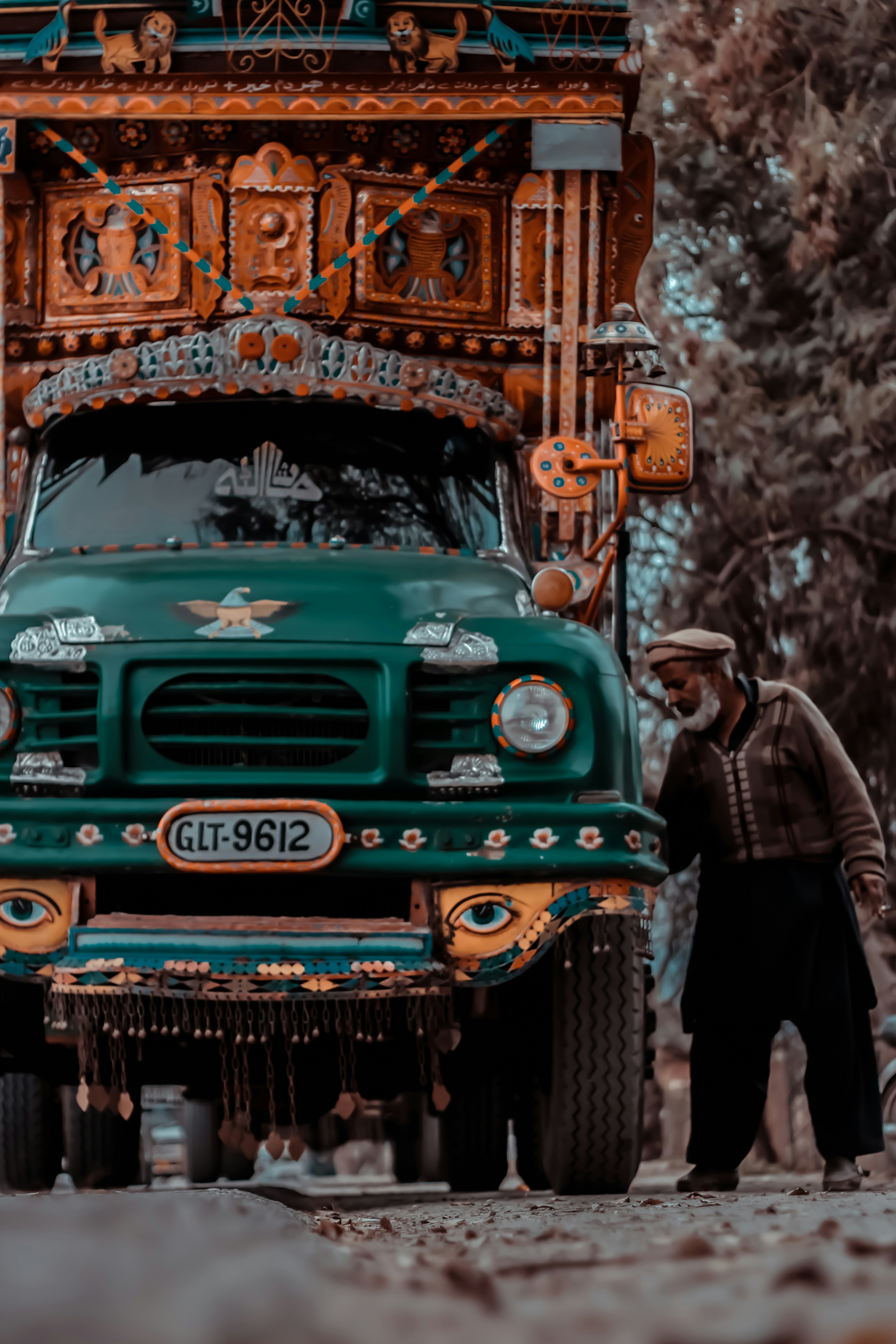 Ornate Freight at Dusk: A Folk-Art Truck and the Quiet Observer