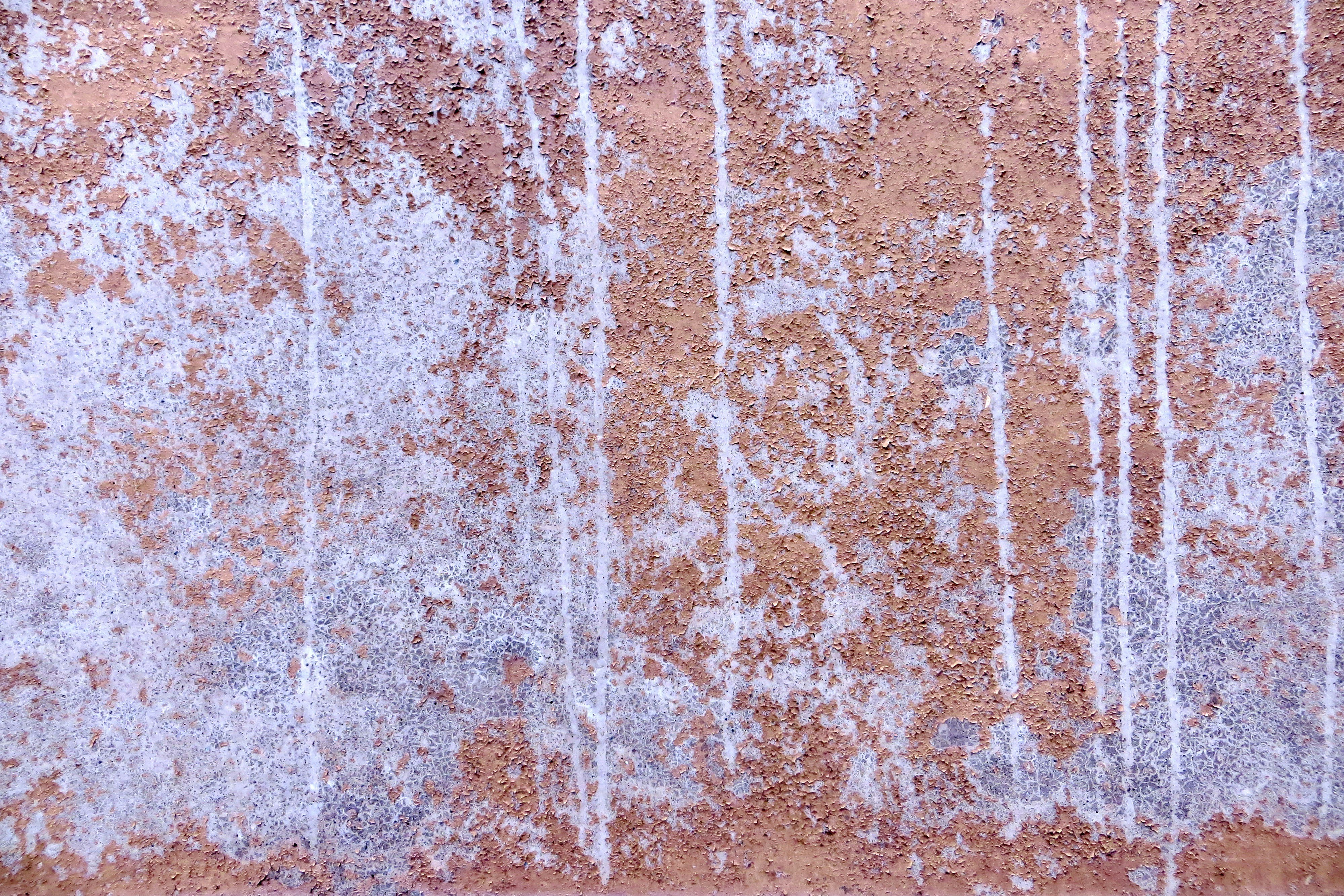 Textured surface revealing layers of weathering and decay, showcasing nature's artistry over time.