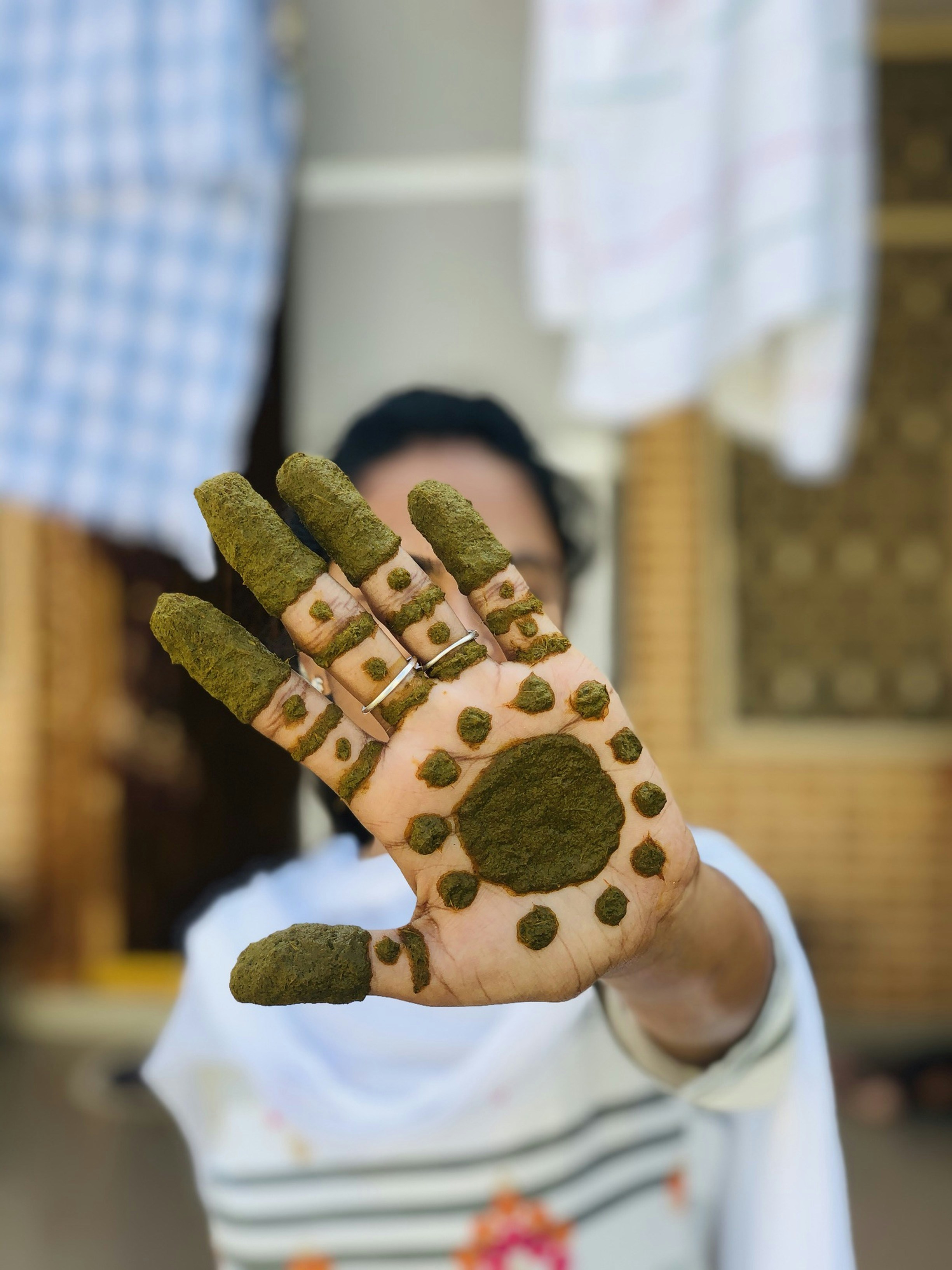 Mud-streaked Hand: A Portrait of Ritual Markings in Motion