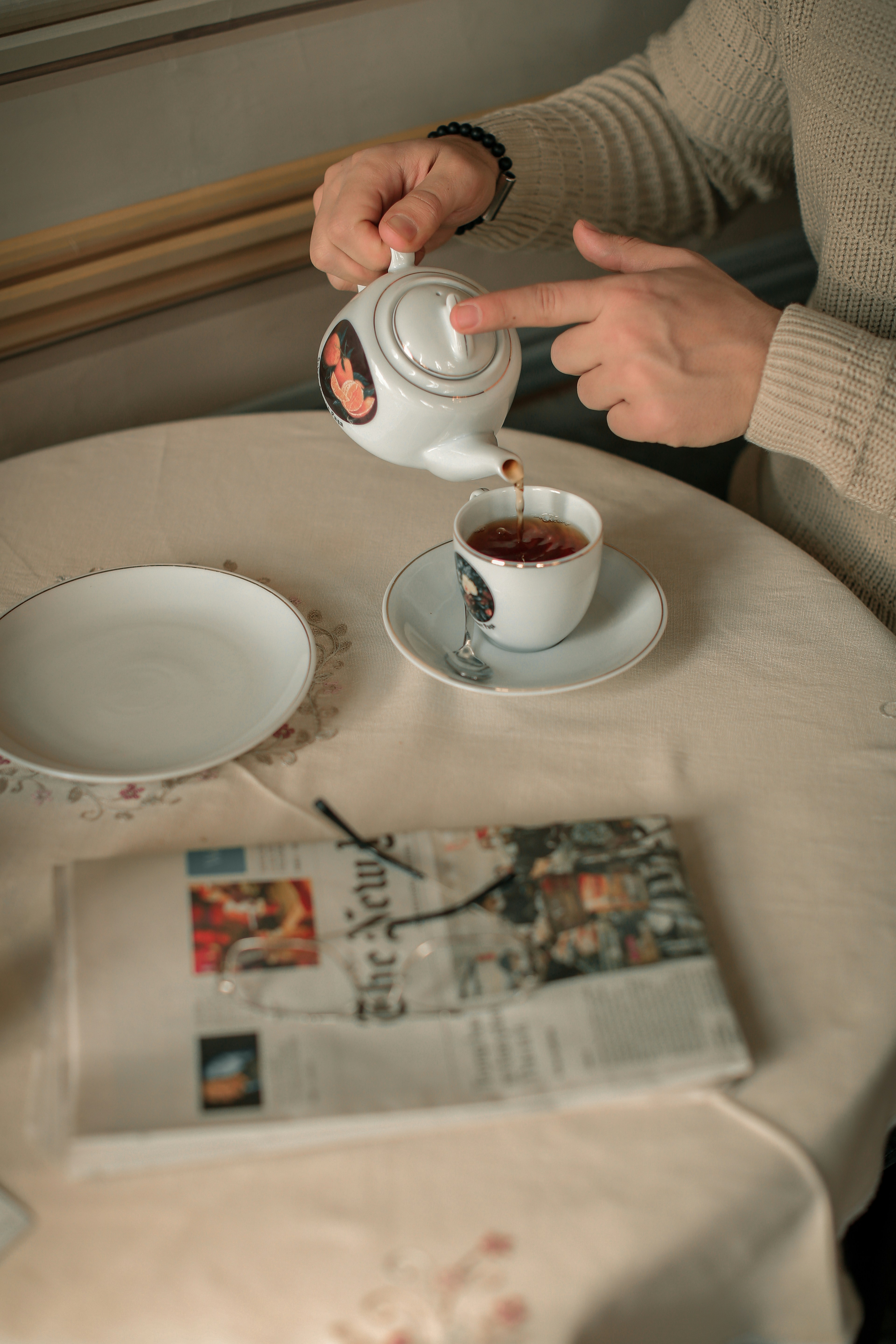 Person pouring white liquid on white ceramic teacup photo – Free Human ...
