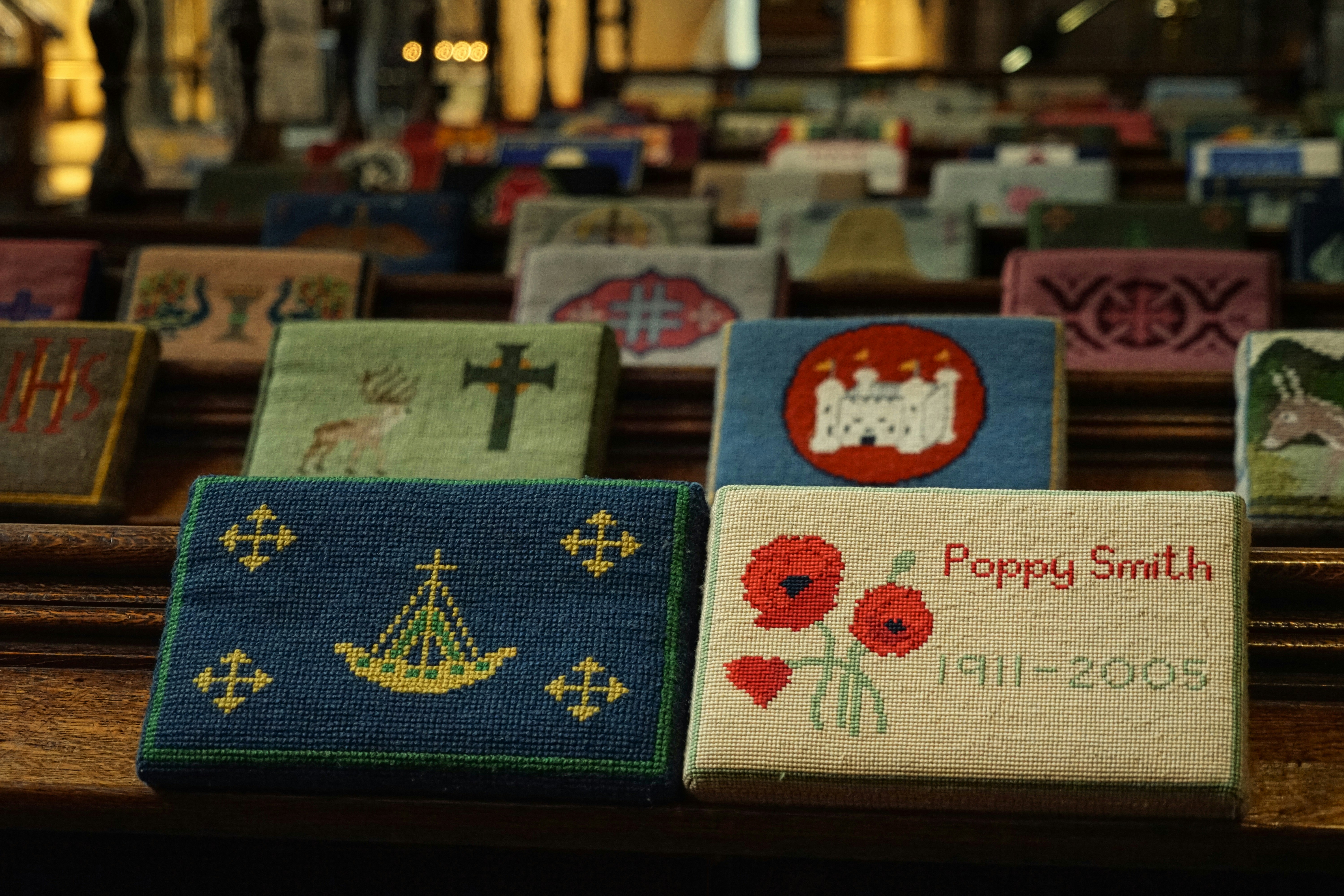 Patchwork Memorial on Church Pews: Poppy, Anchor, and Castle