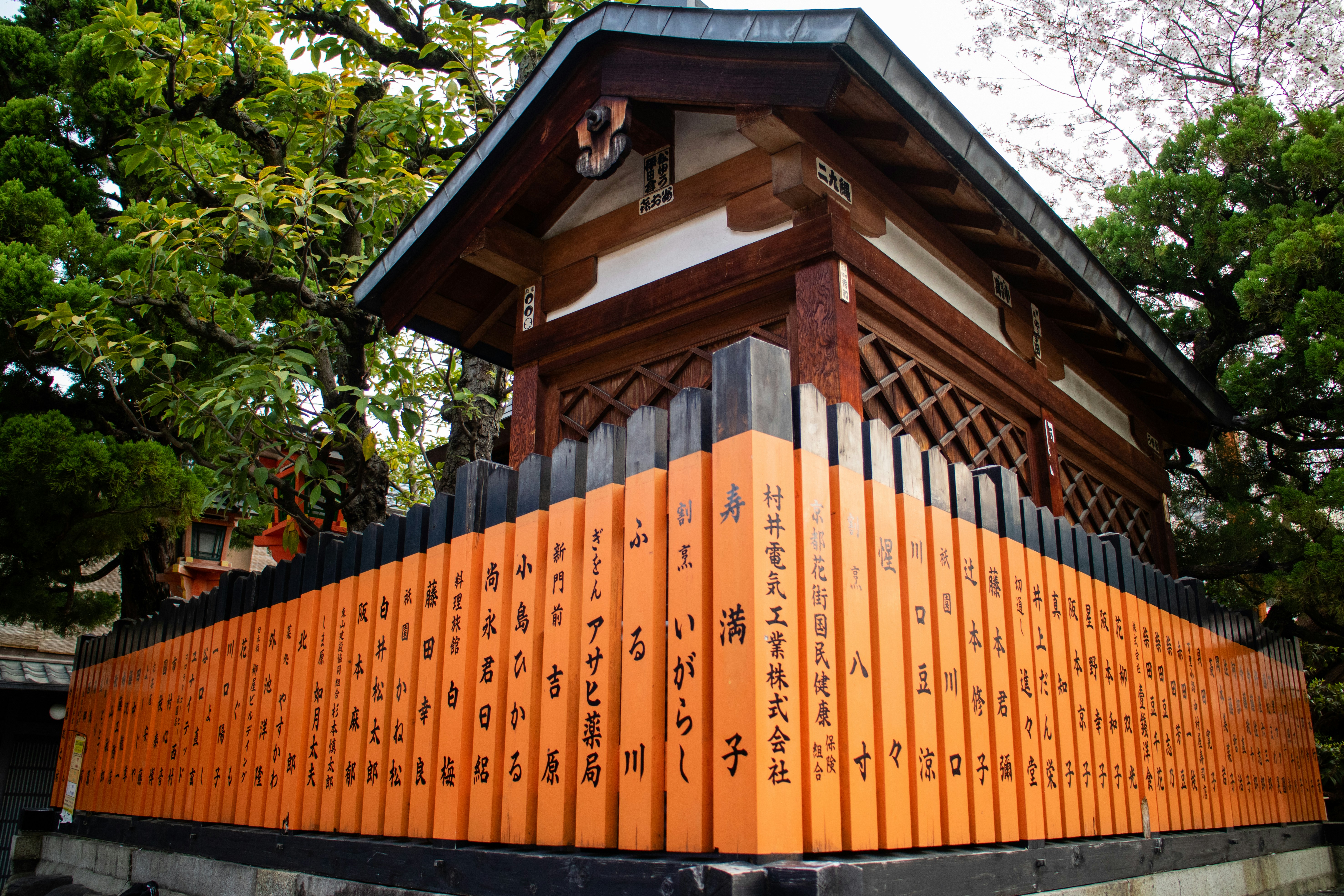 Ceremonial Orange Banners Enclose a Timber Shrine