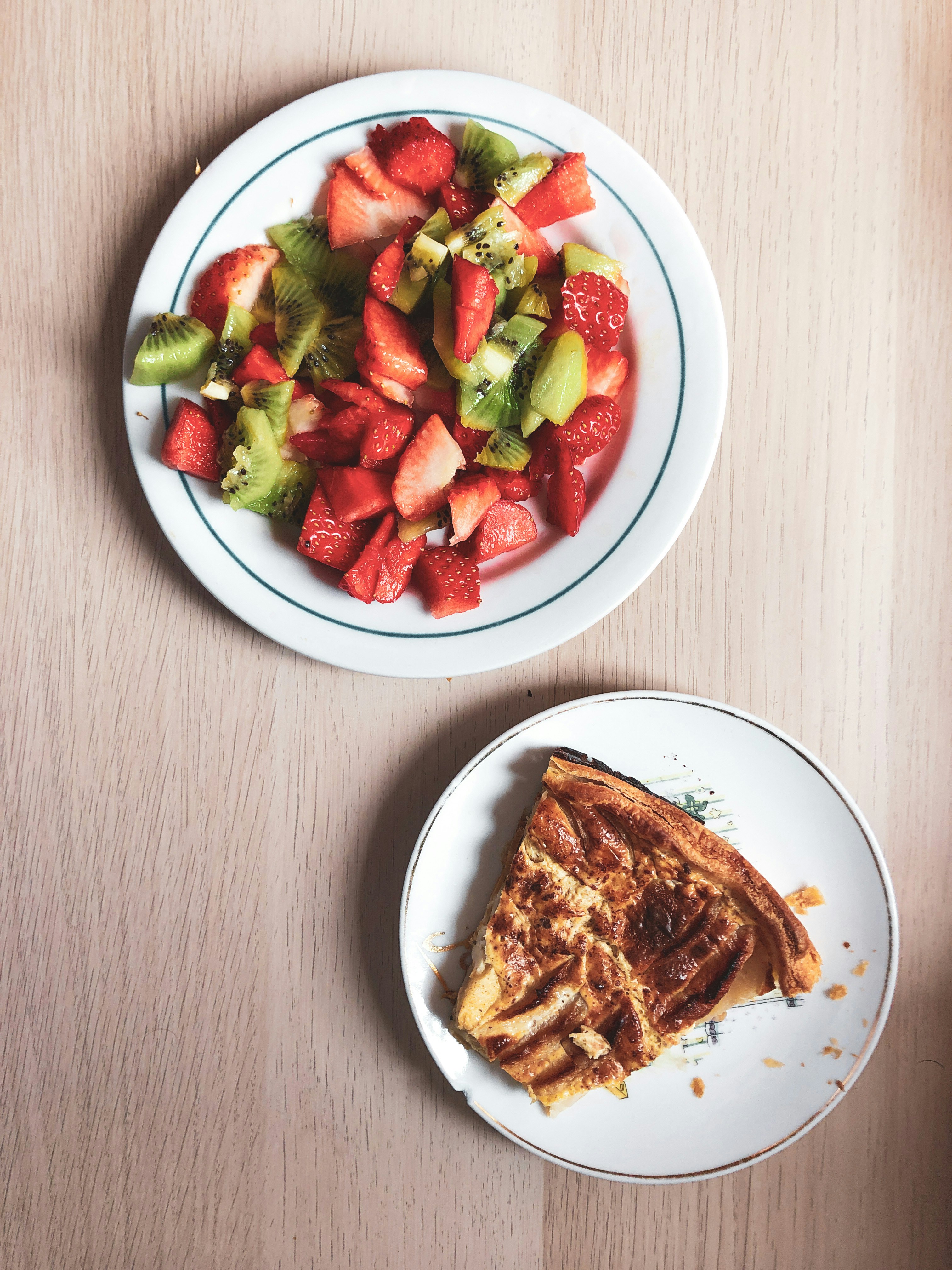 Two Plates, One Pantry: Fresh Fruit Bowl Above a Slice of Pie