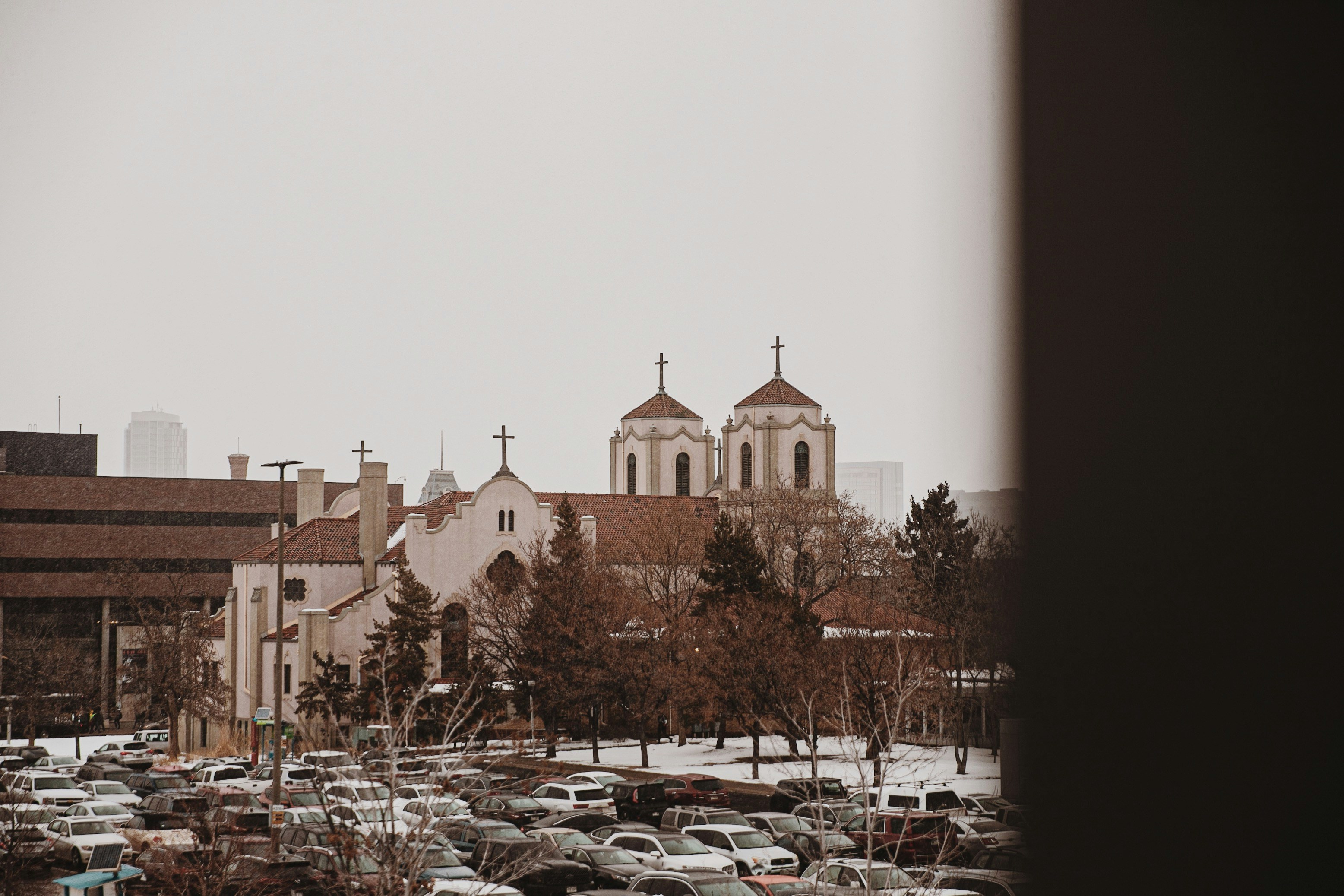 Catholic Chapel Skyline Framed by Parking Lot Veil