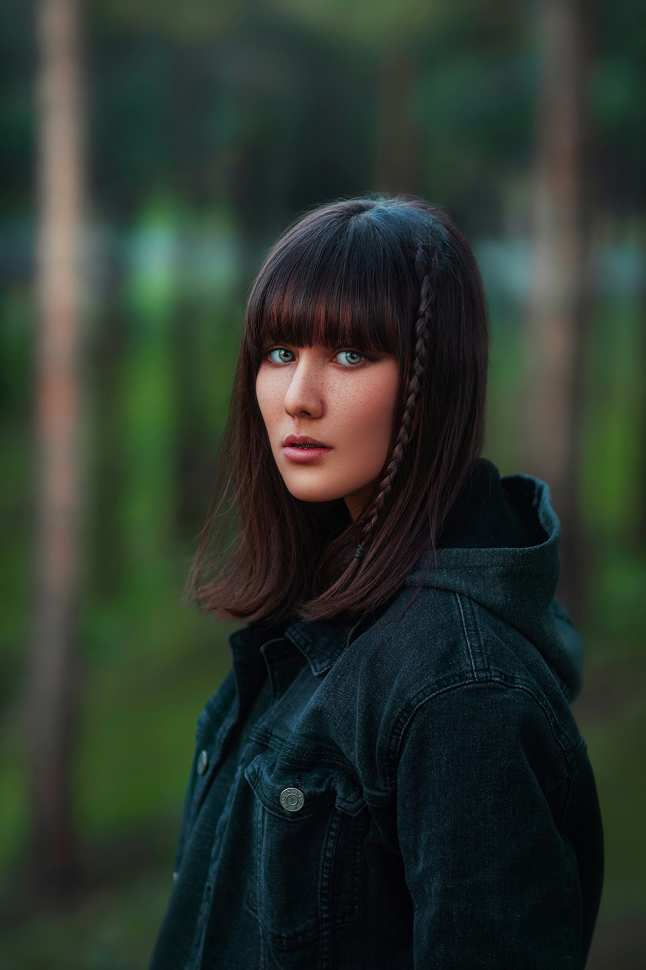Emerald Gaze Against a Pine Forest Veil