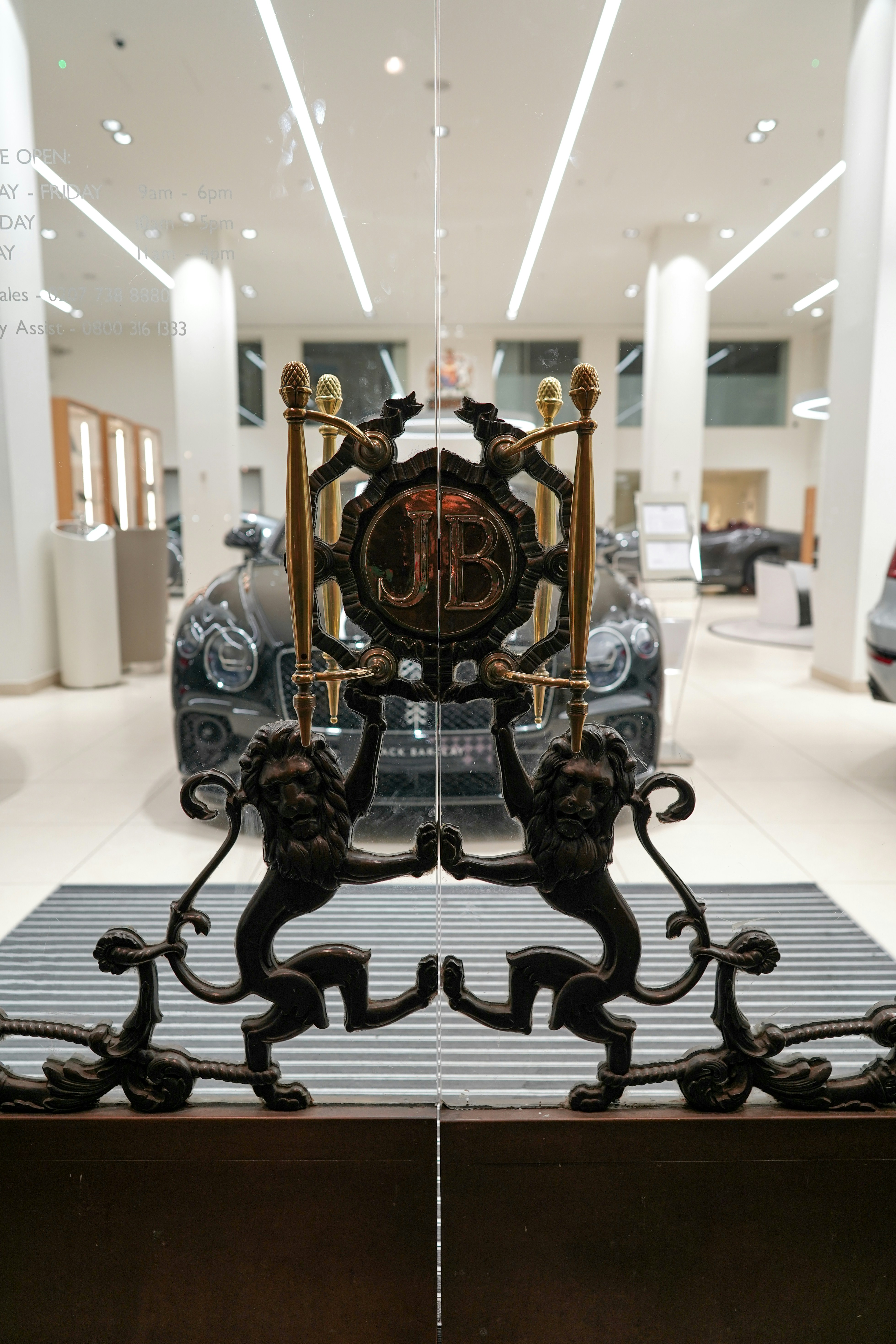 Ornate Ironwork Framing a Luxury Car Gateway