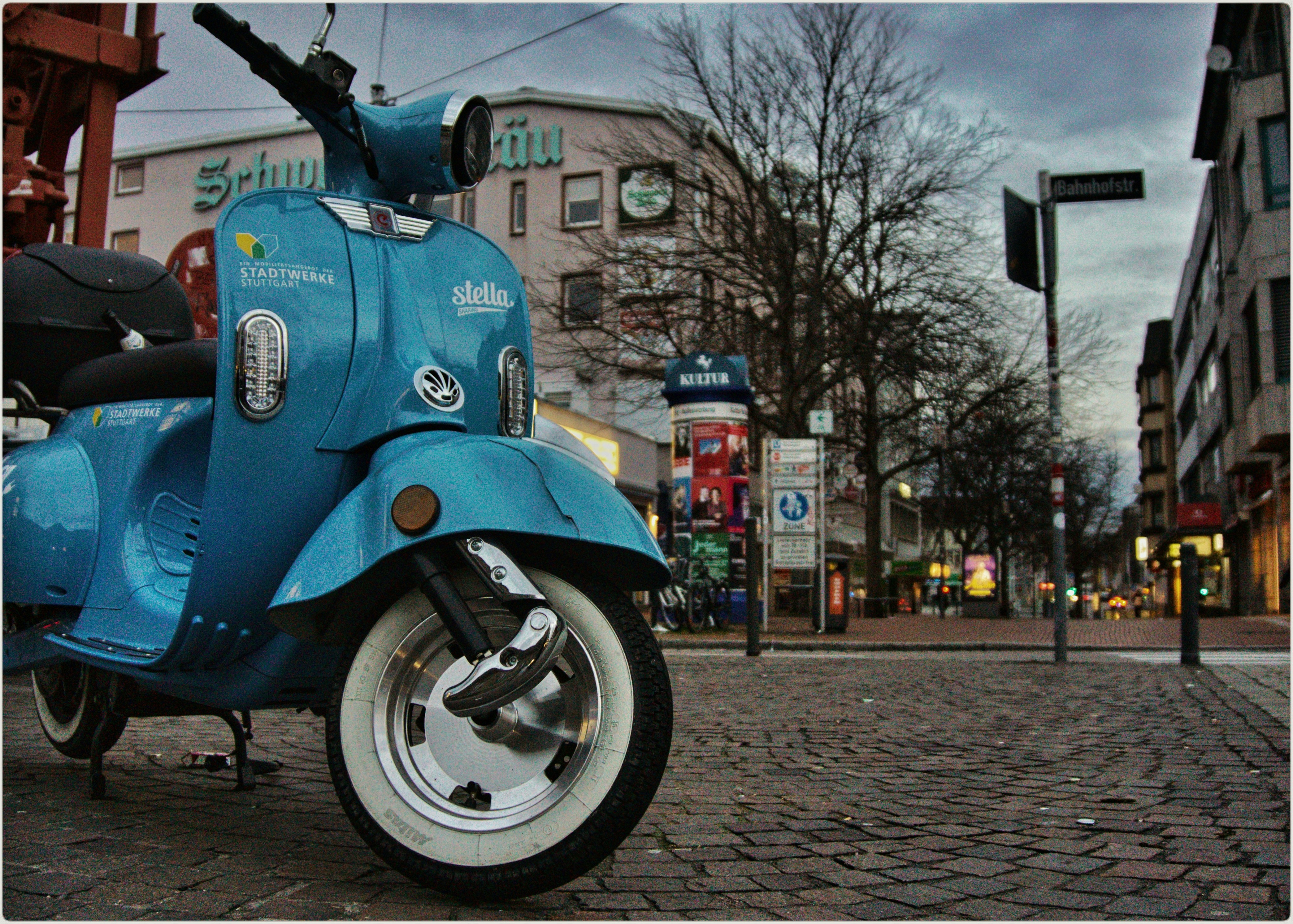 Blue Vespa at Dusk: A Quiet Corner of the City