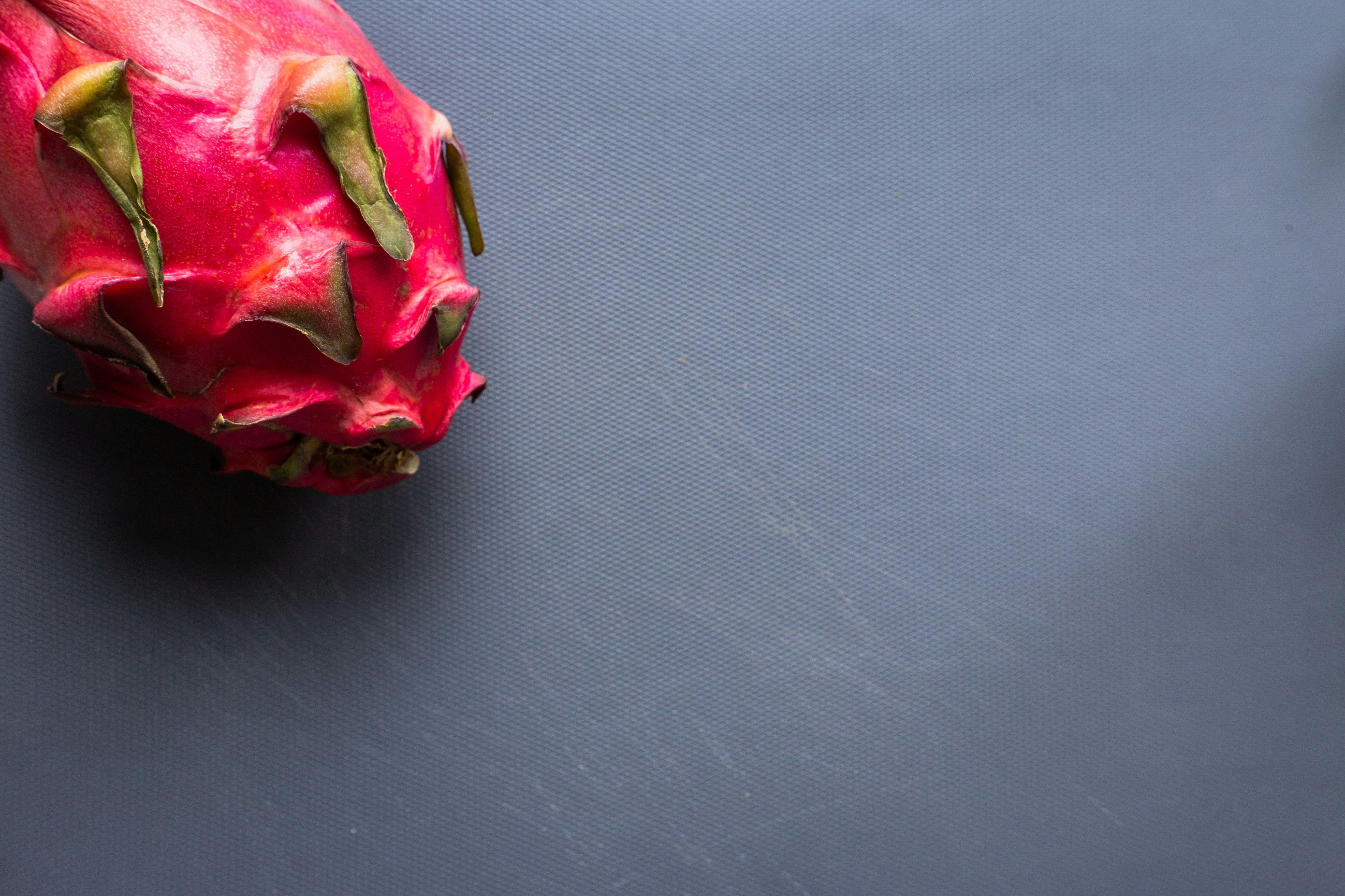 Magenta Dragonfruit on Slate: a Minimalist Study in Texture and Contrast
