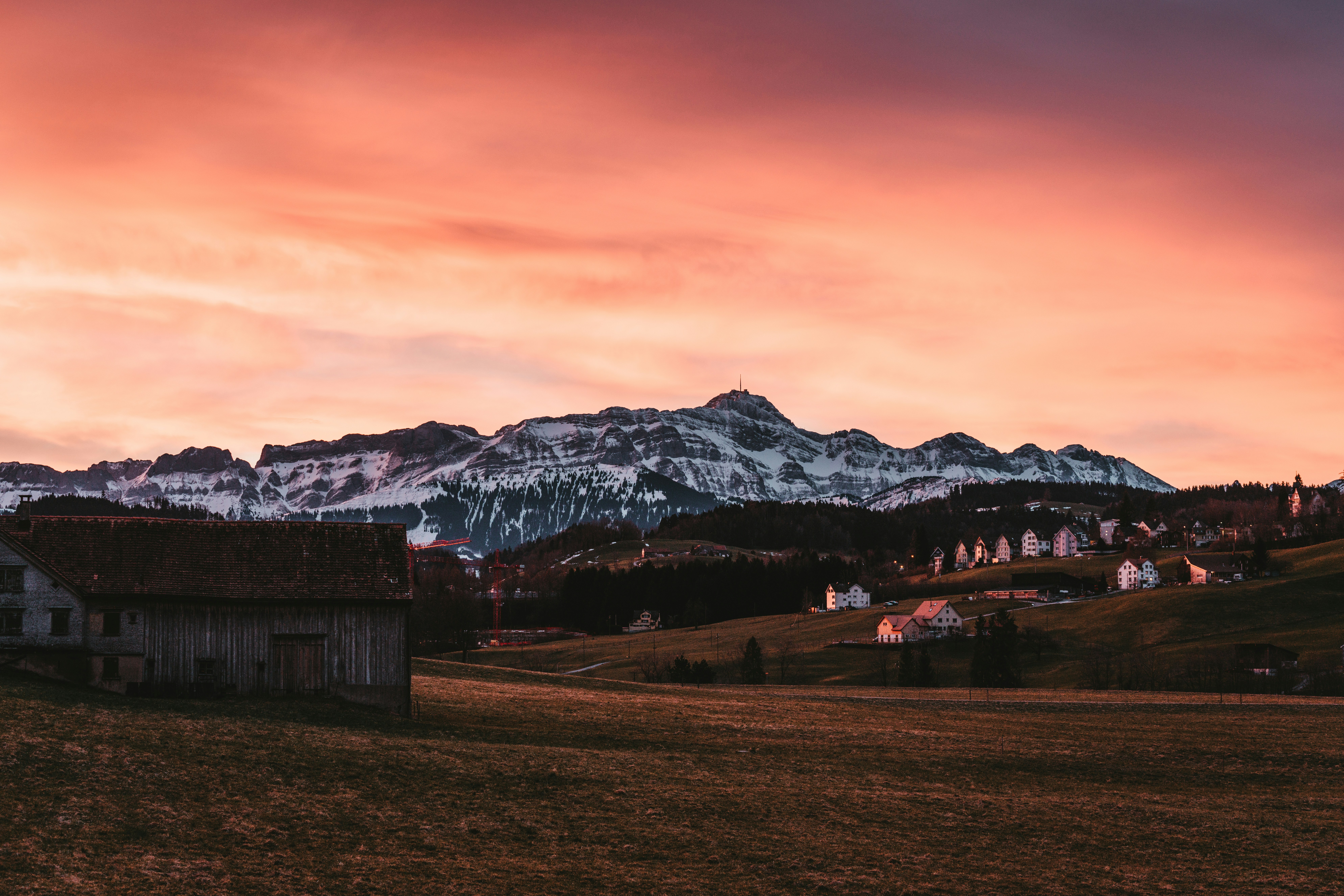 Crimson Crest: Snow-kissed Peaks Under a Velvet Sunset