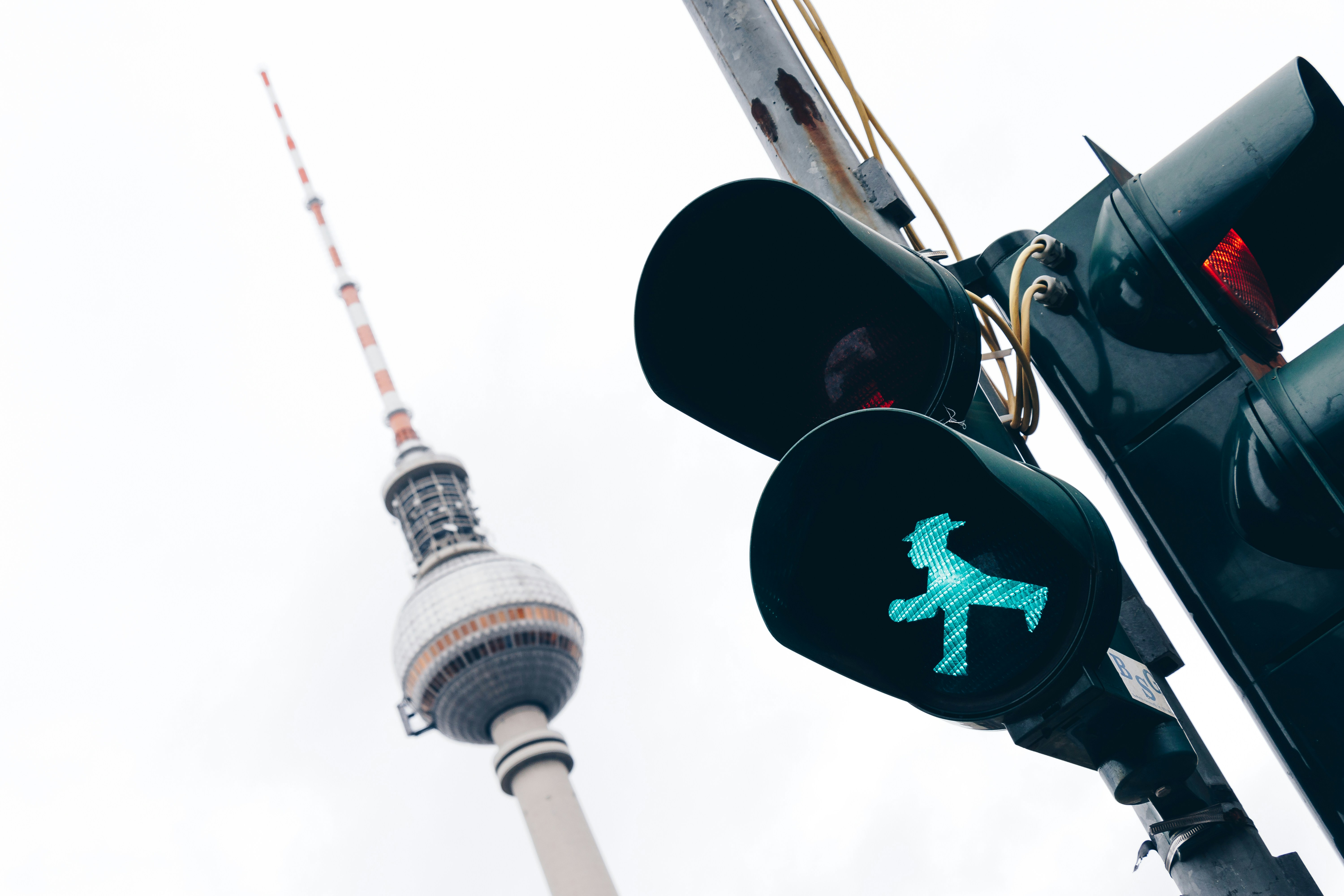 Green Walk Signal Framed by Berlin's Iconic Fernsehturm