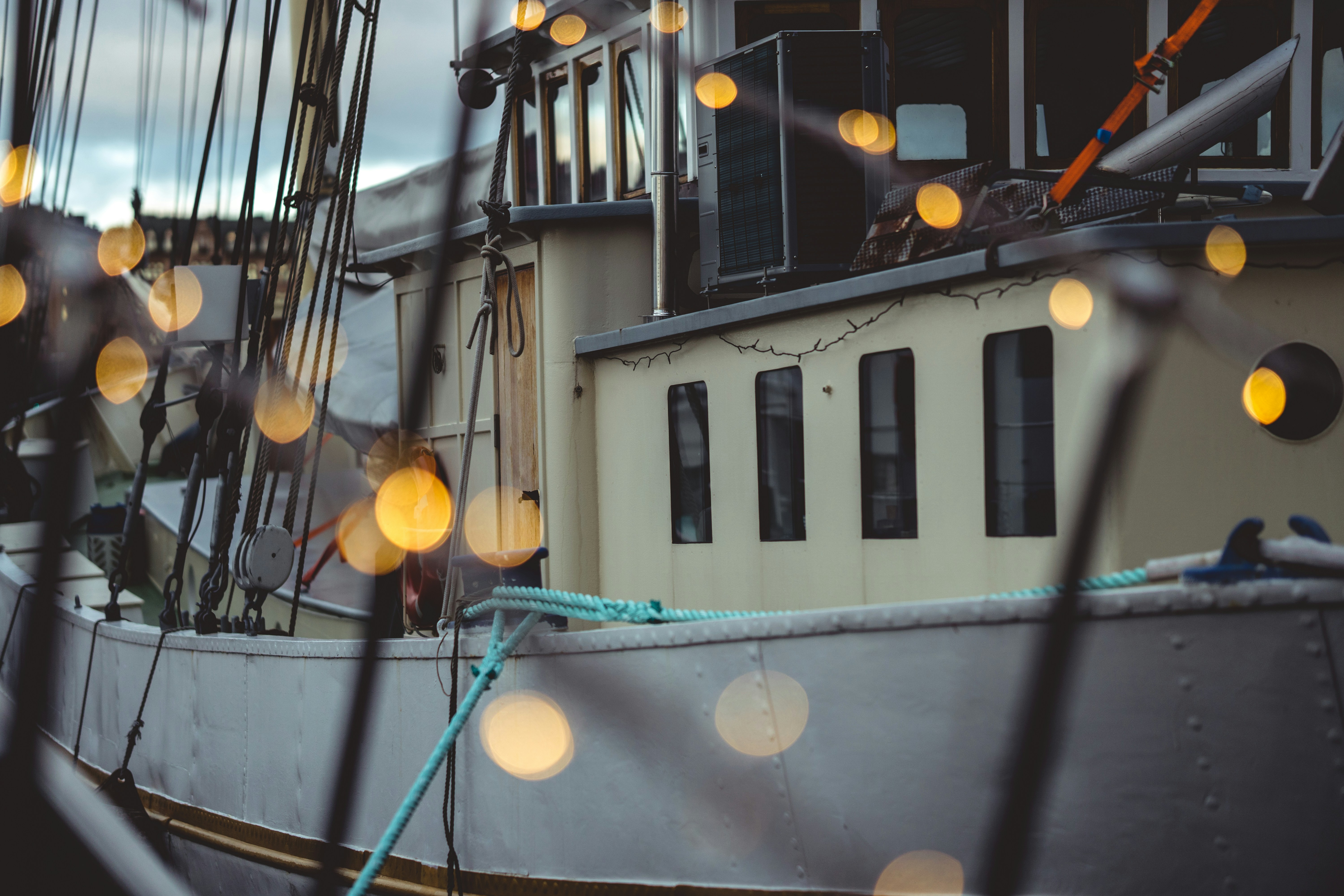 Harbor in Soft Focus: A Weathered Vessel Framed by Evening Bokeh
