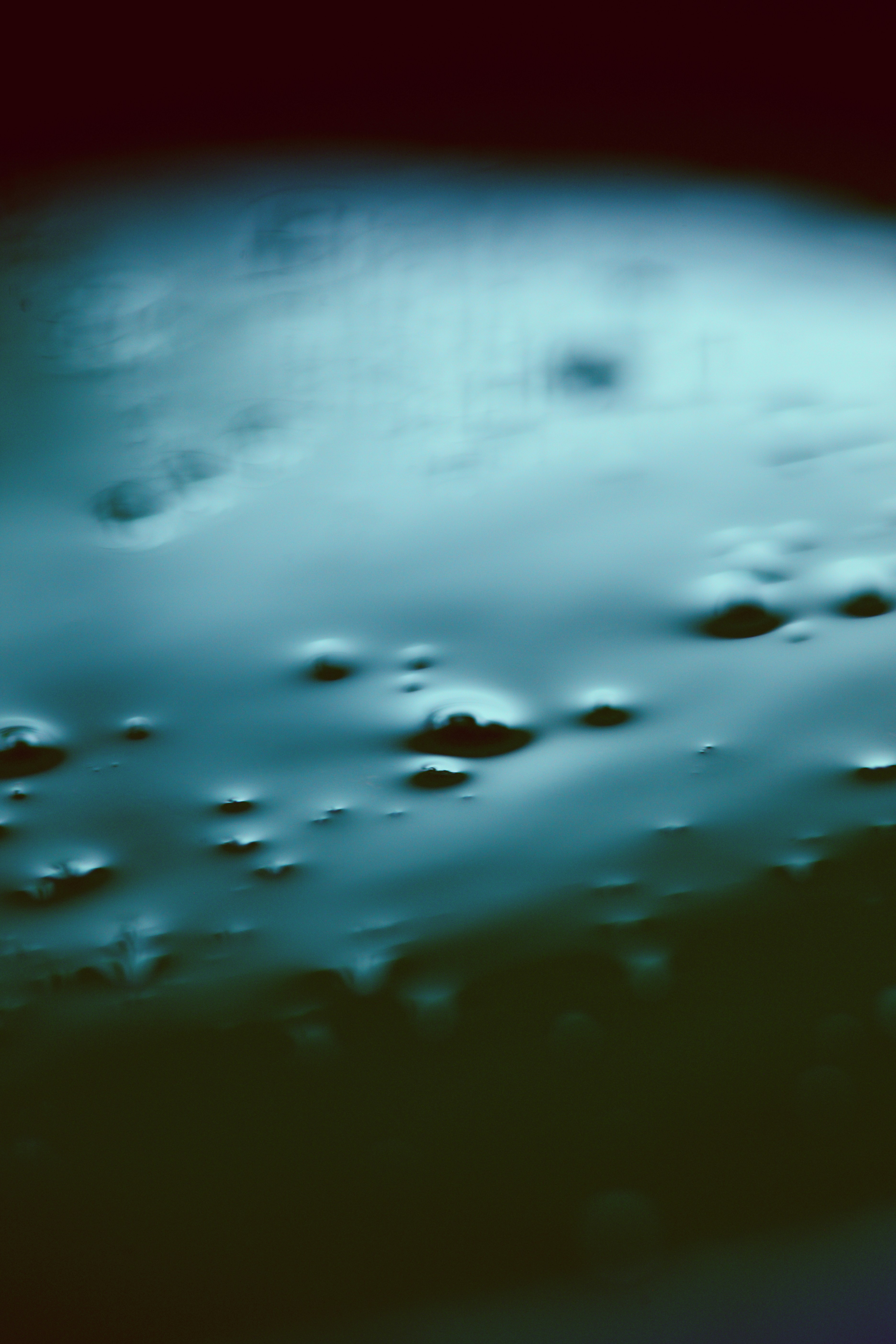 Dark liquid teal blue background.