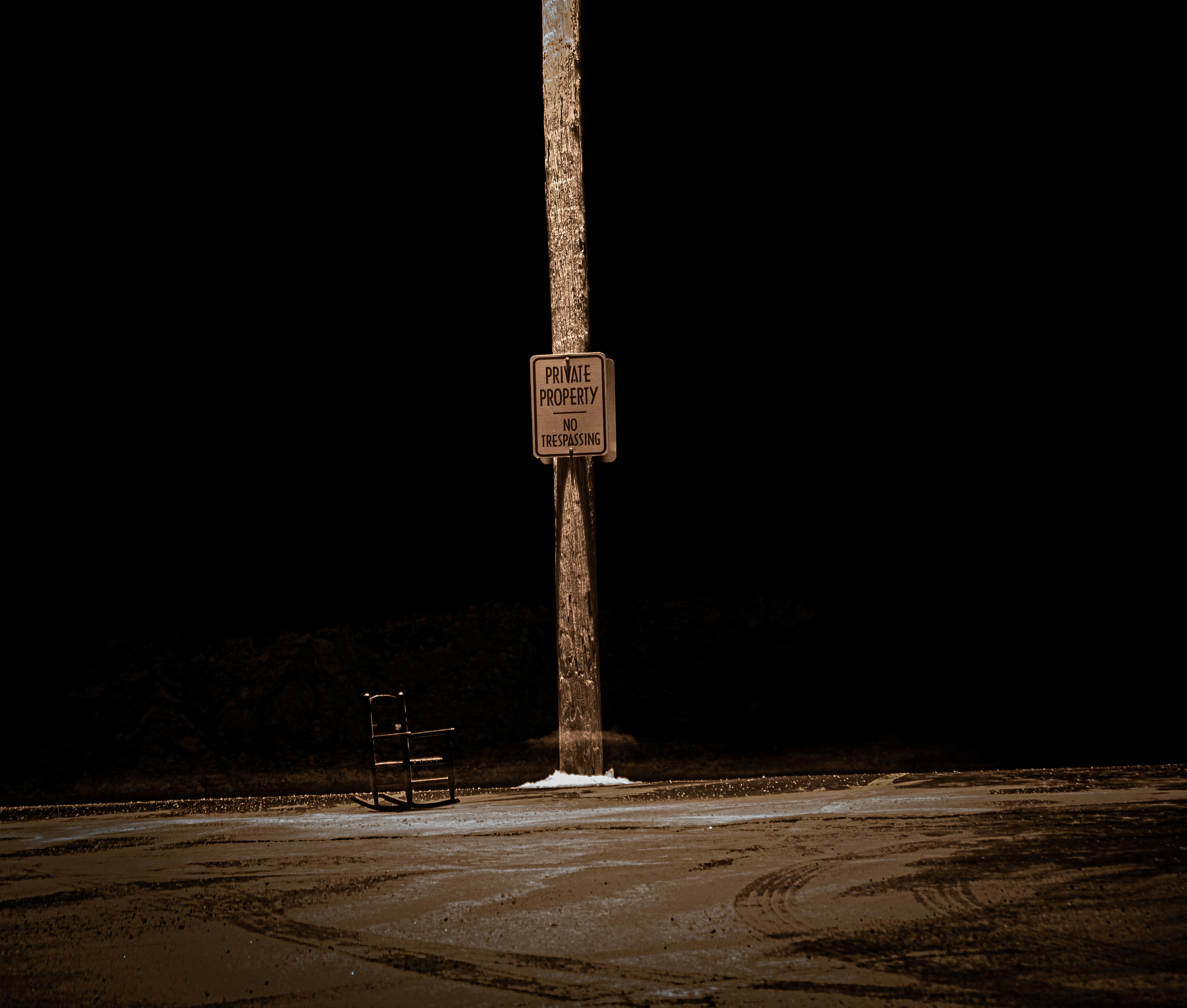 Lonely Signpost and Bench under Night Silence