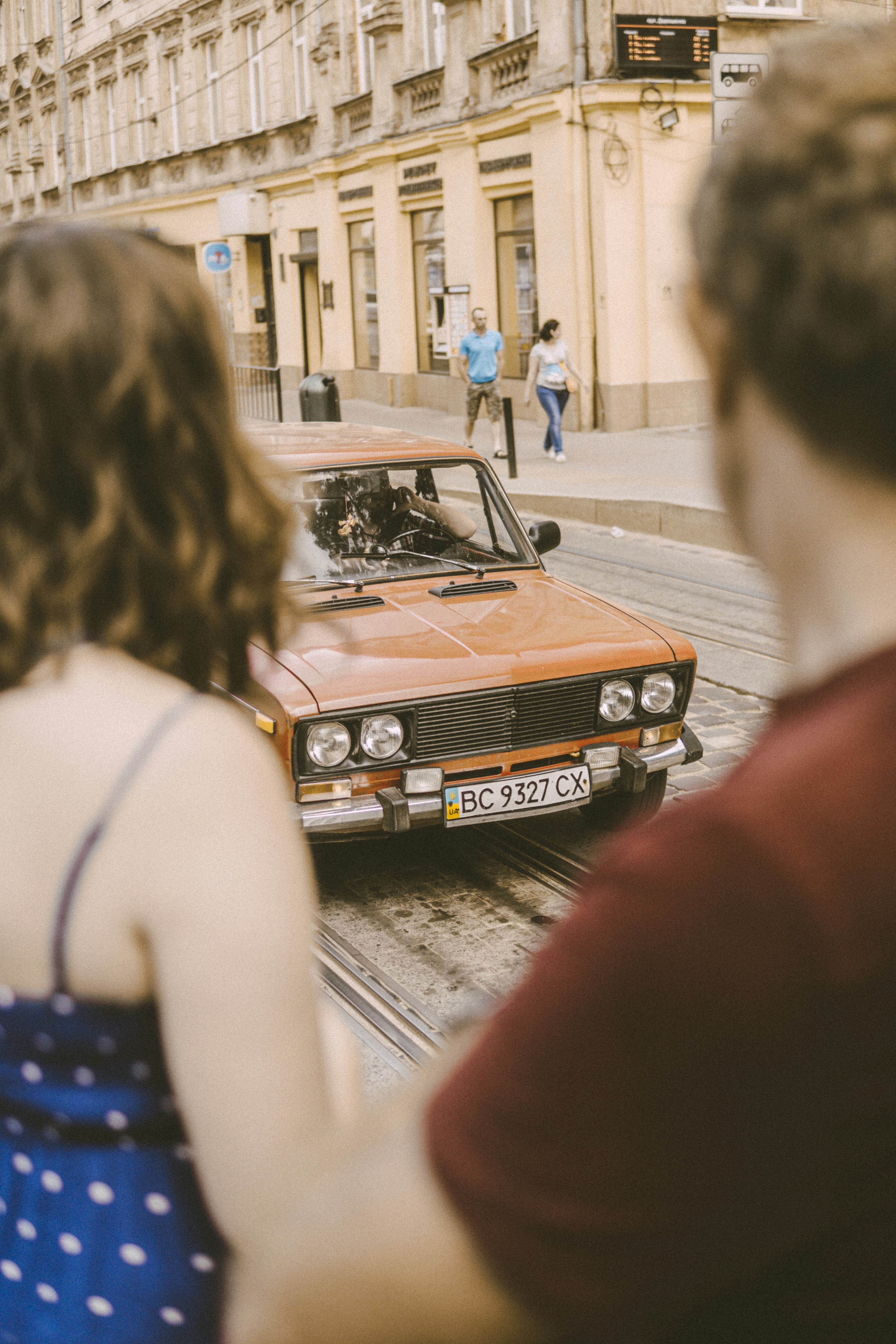 Midstreet Gaze: The Red Car Between Worlds
