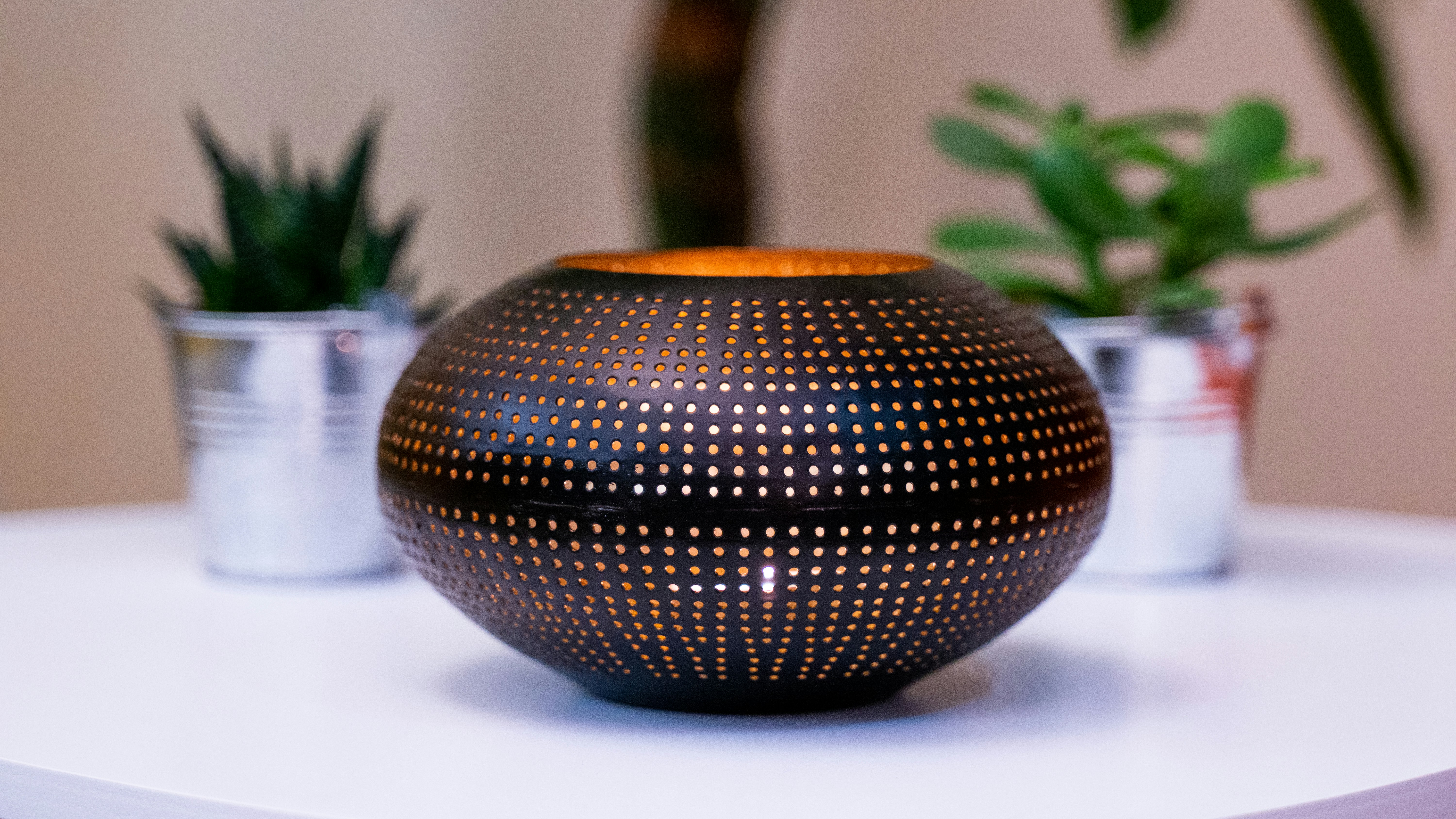 Dotted Ember: A Lantern Vase on a Quiet Mantel