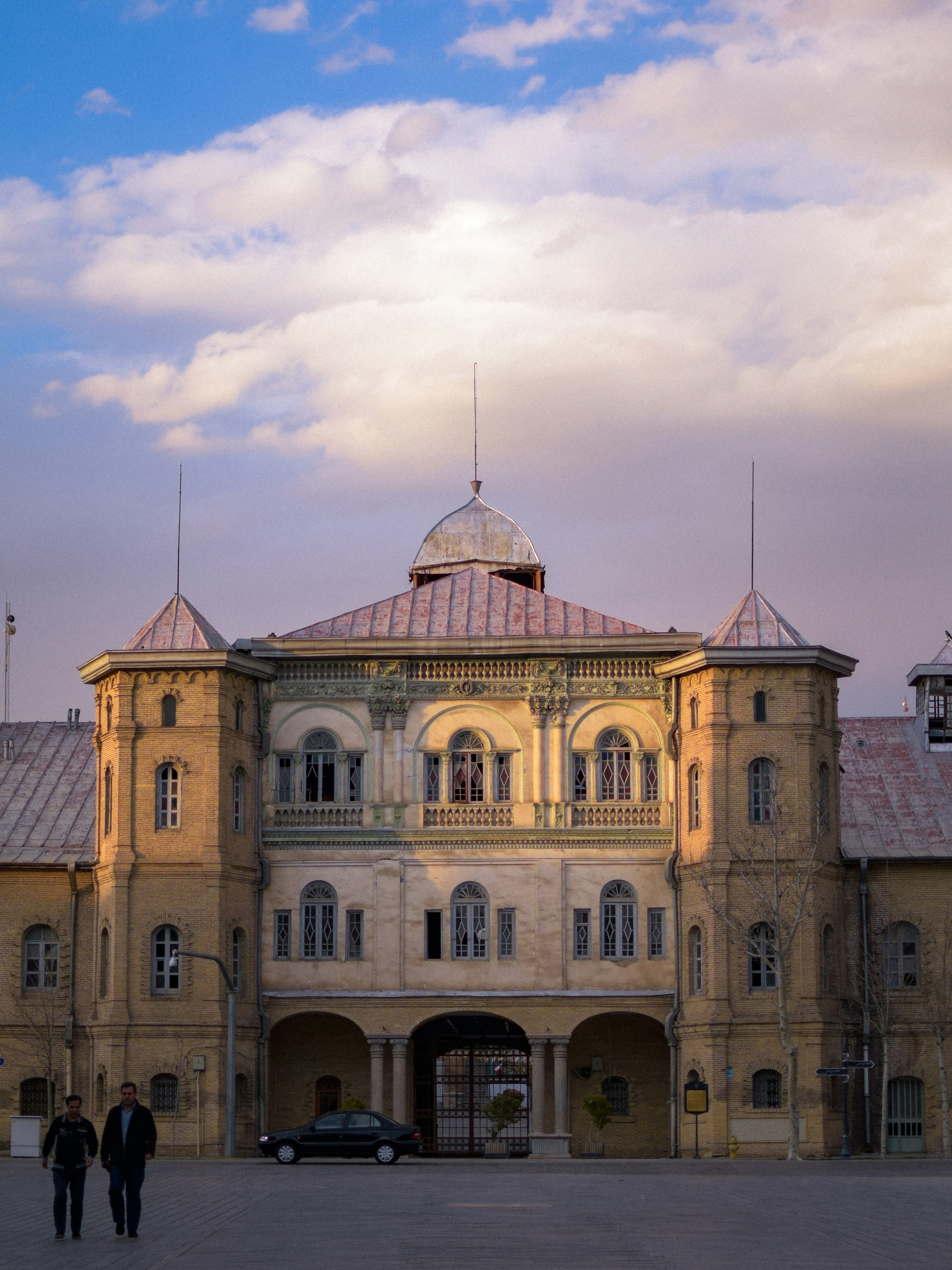 Facade at Dusk: Historic Building Framed by Soft Golden Light