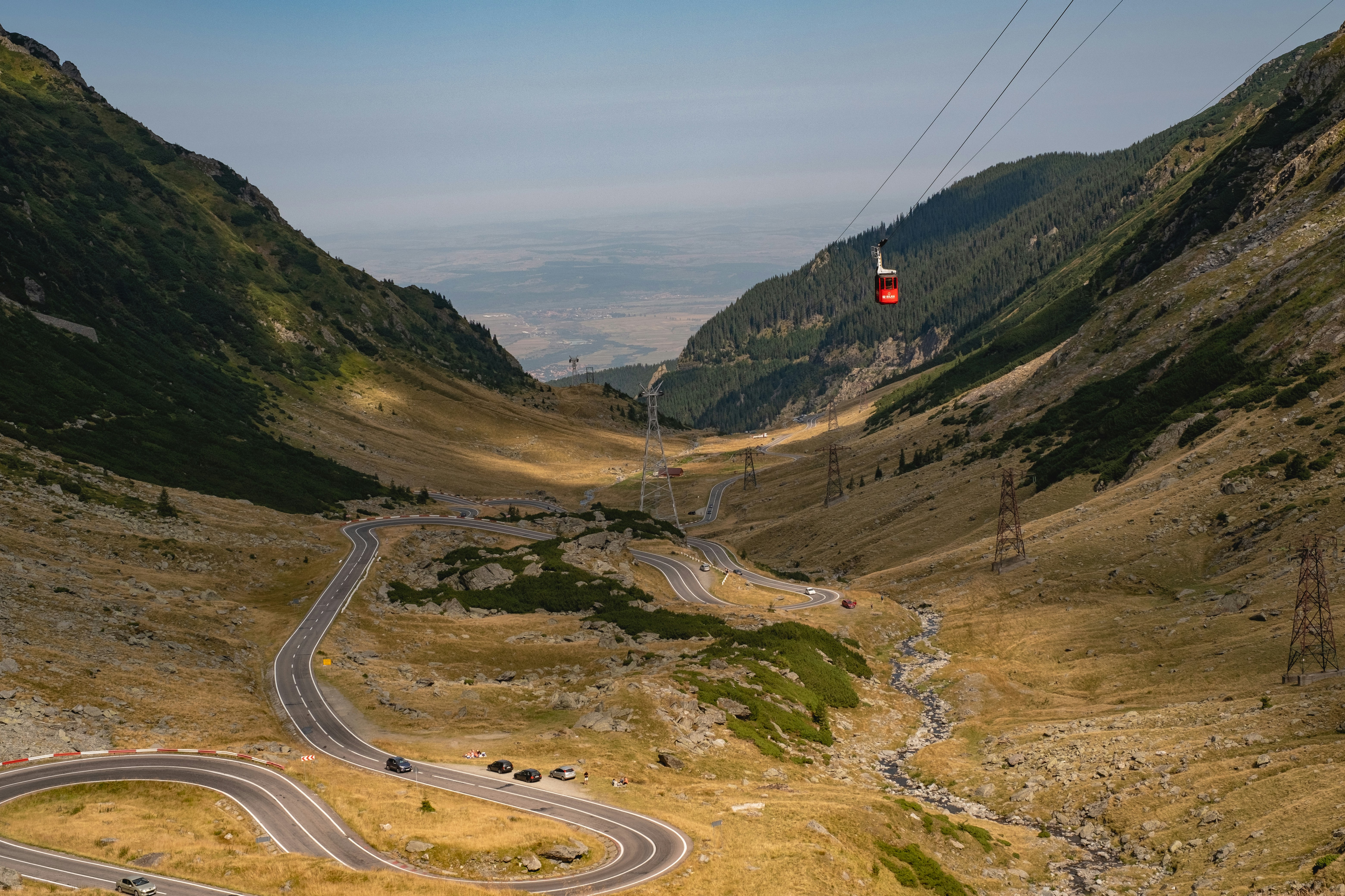 black car on road near mountains during daytime