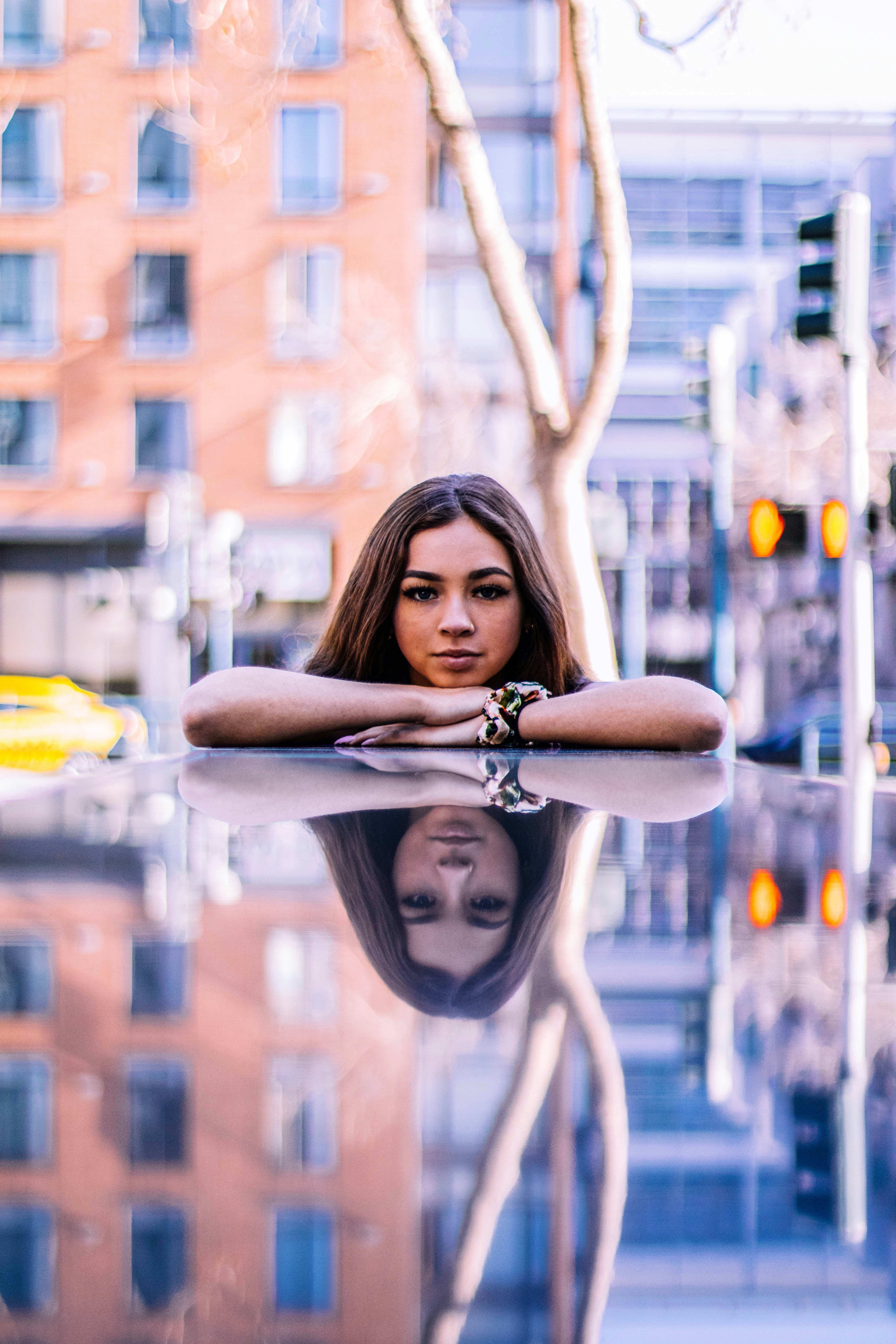 Mirror of the City: A Portrait Reflected on a Glass Surface