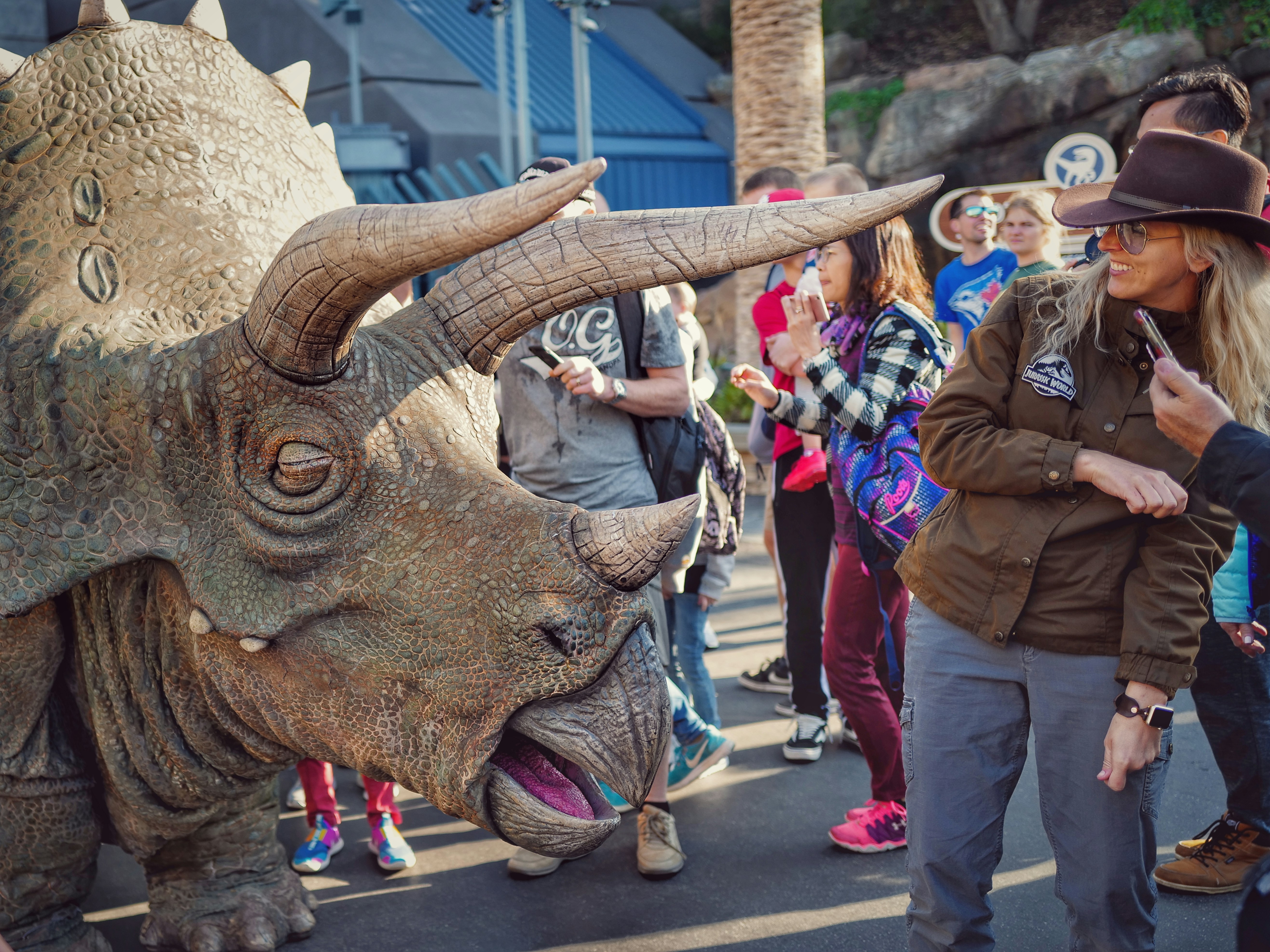 Horned Titan Draws a Crowd: A Triceratops Sculpture in Focus