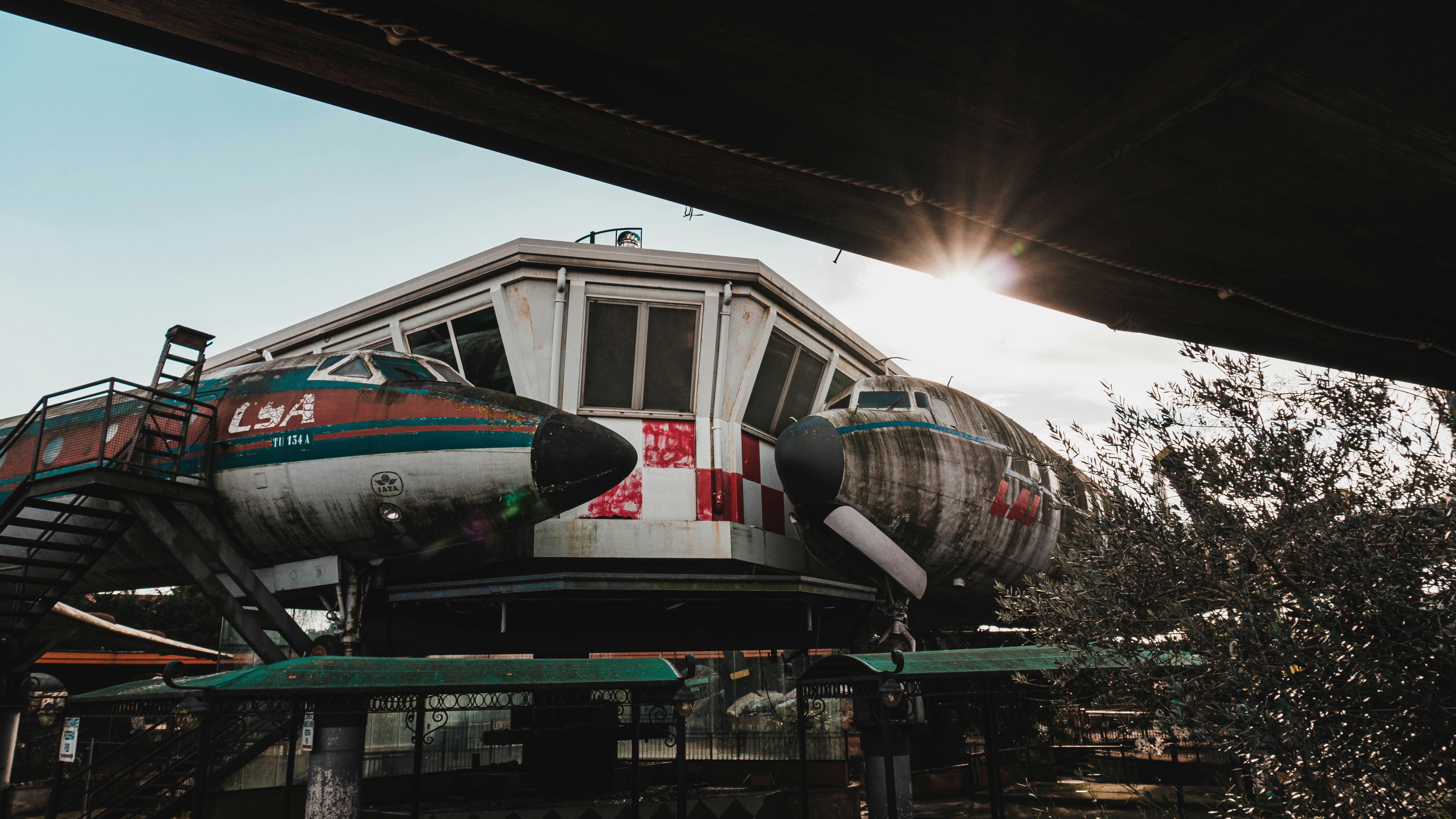 Sunlit Docked Boats: A Weathered Ride Under the Pier