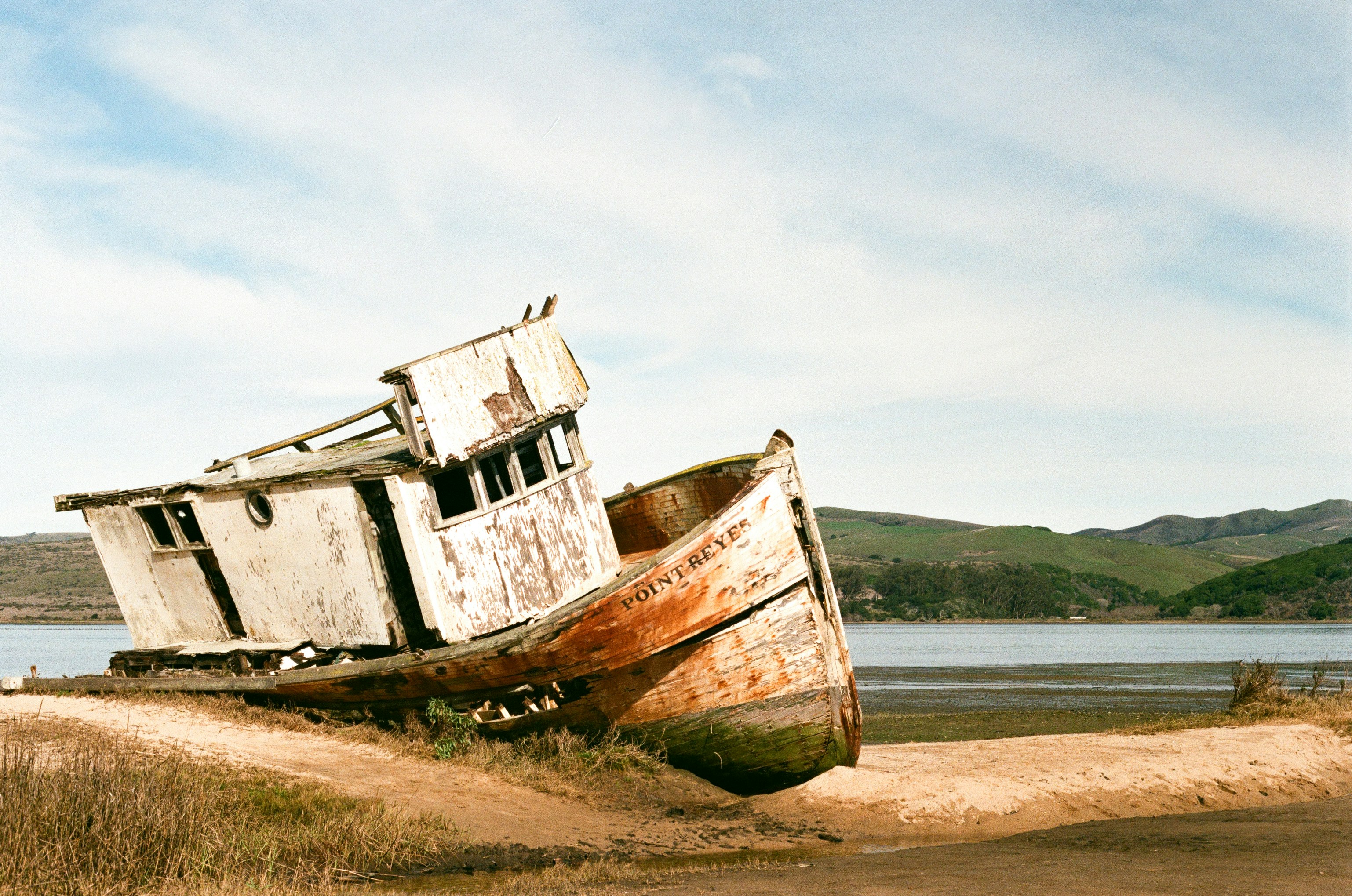 Brown and white boat on seashore during daytime photo – Free Boat Image ...